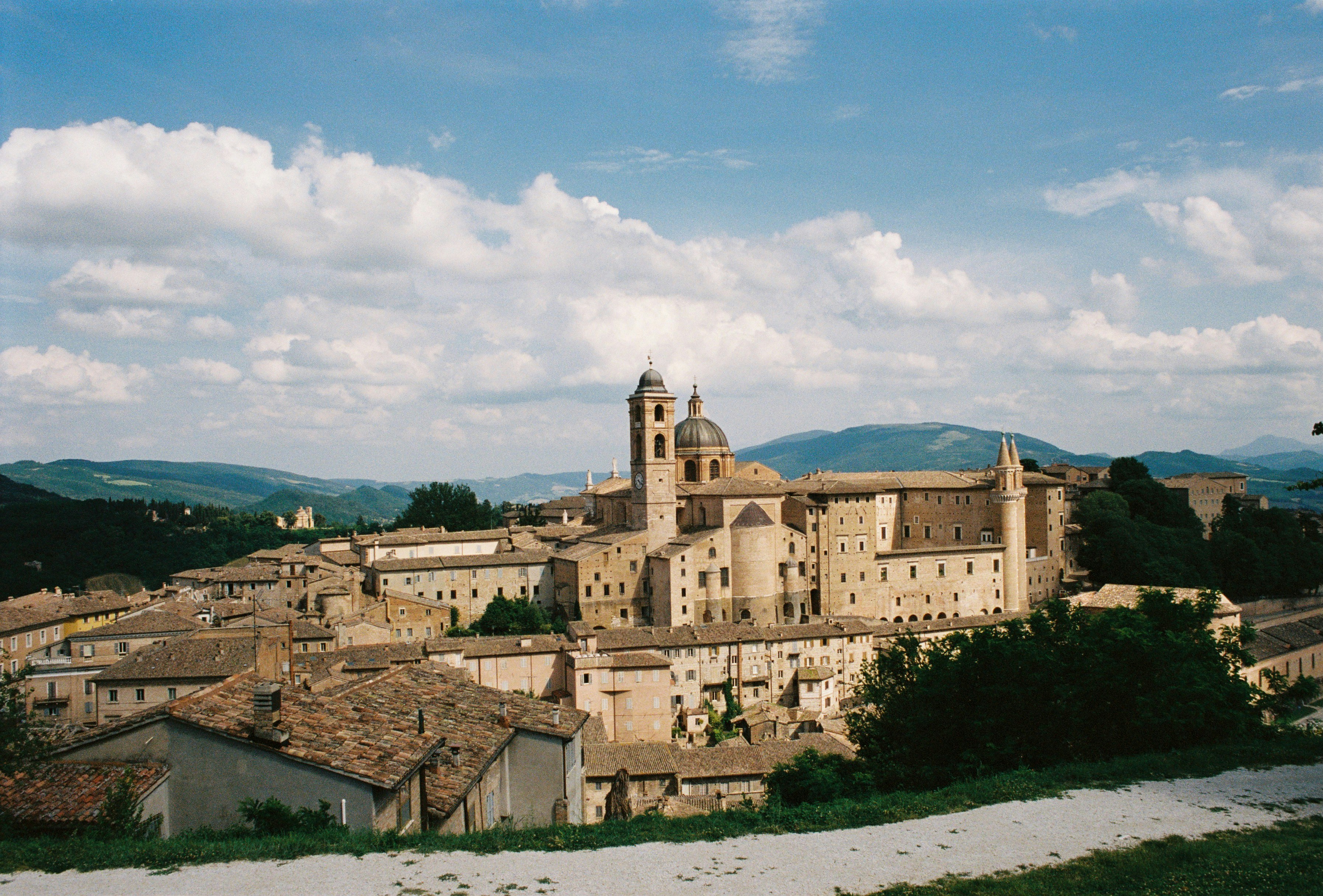 Sunlit Hilltop Monastery Overlooking a Tuscan Village