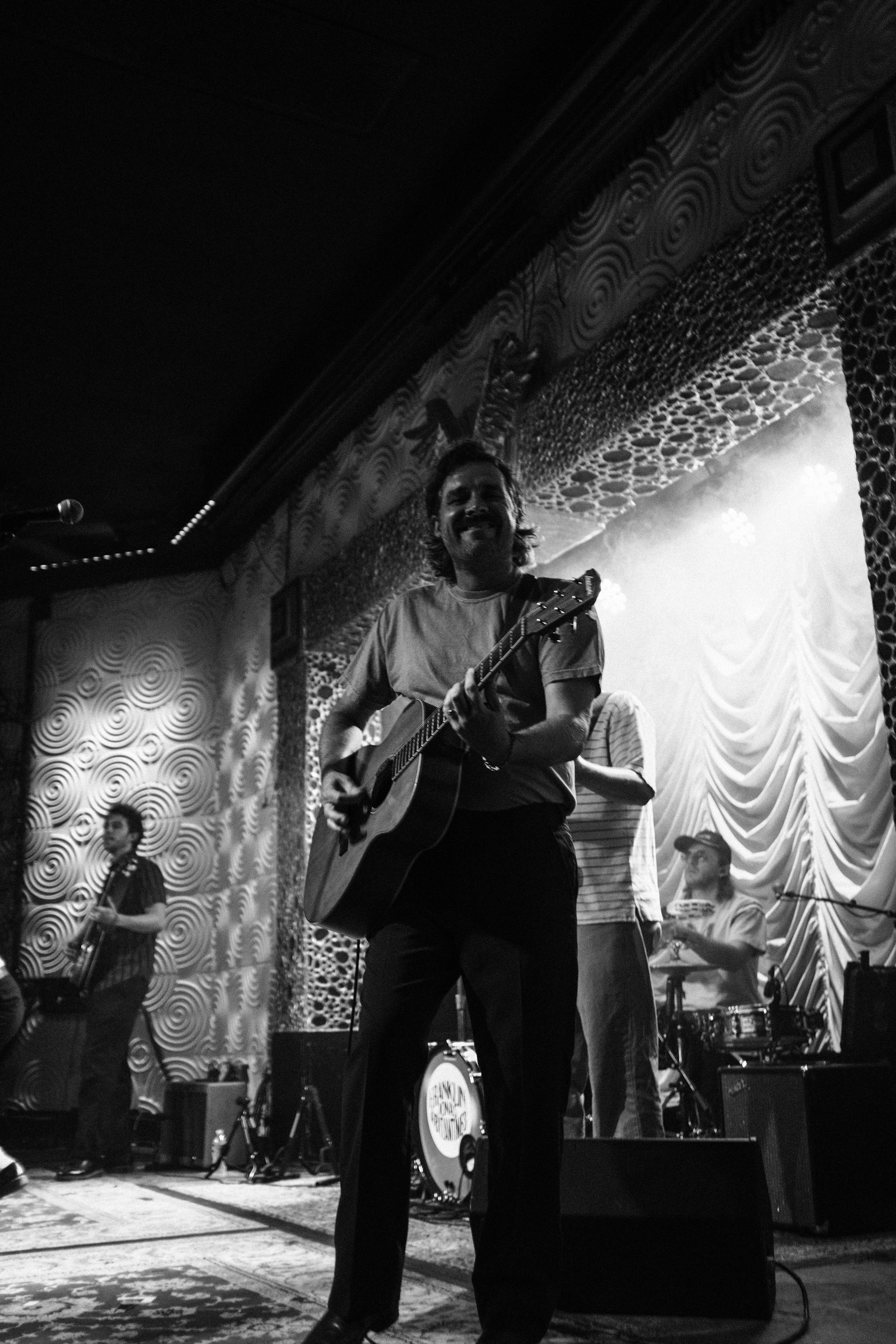 Midnight Serenade: The Frontman in a Velvet Spotlight