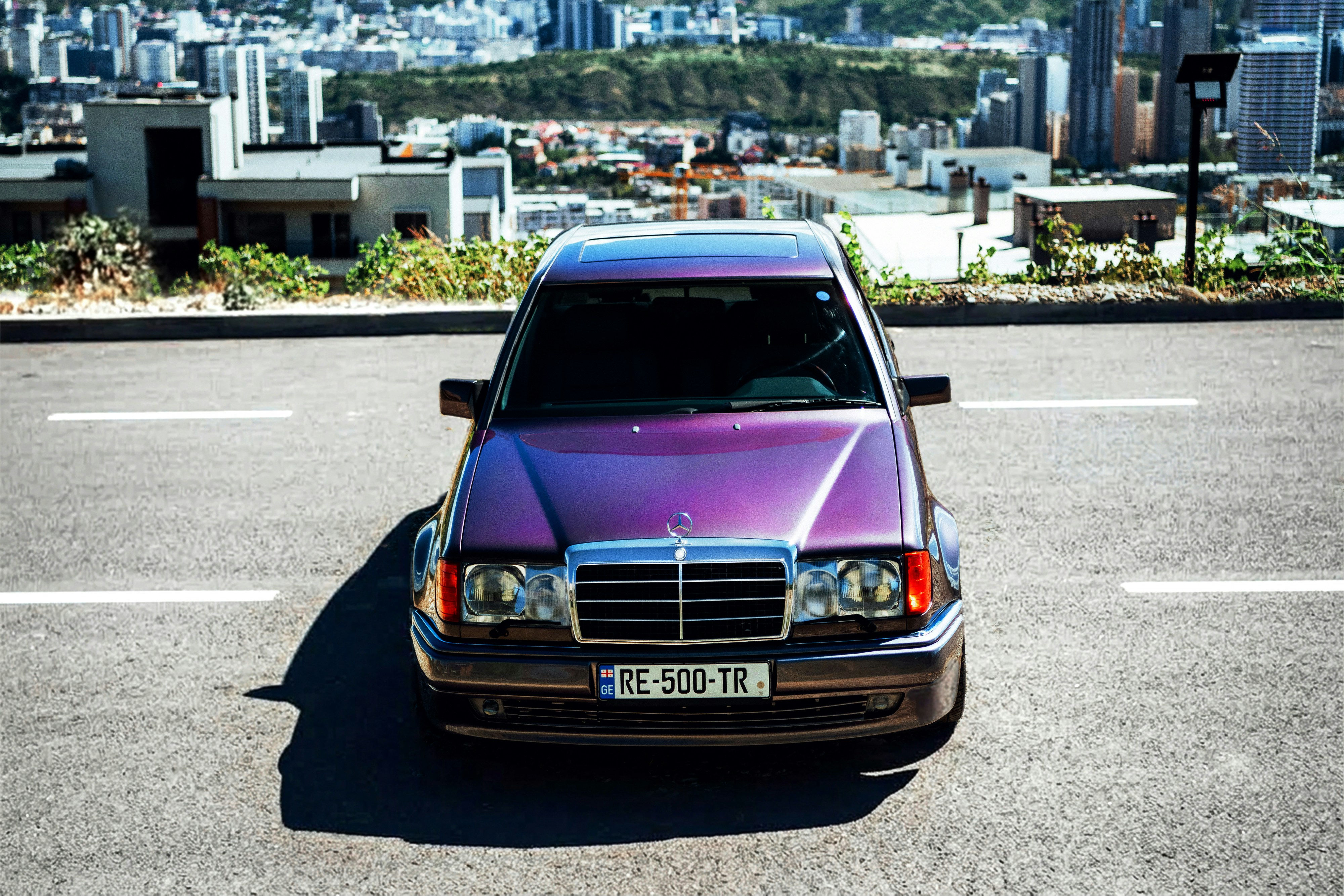 Royal Crest on the Crest: A Metallic M-Badge Stares Down the City