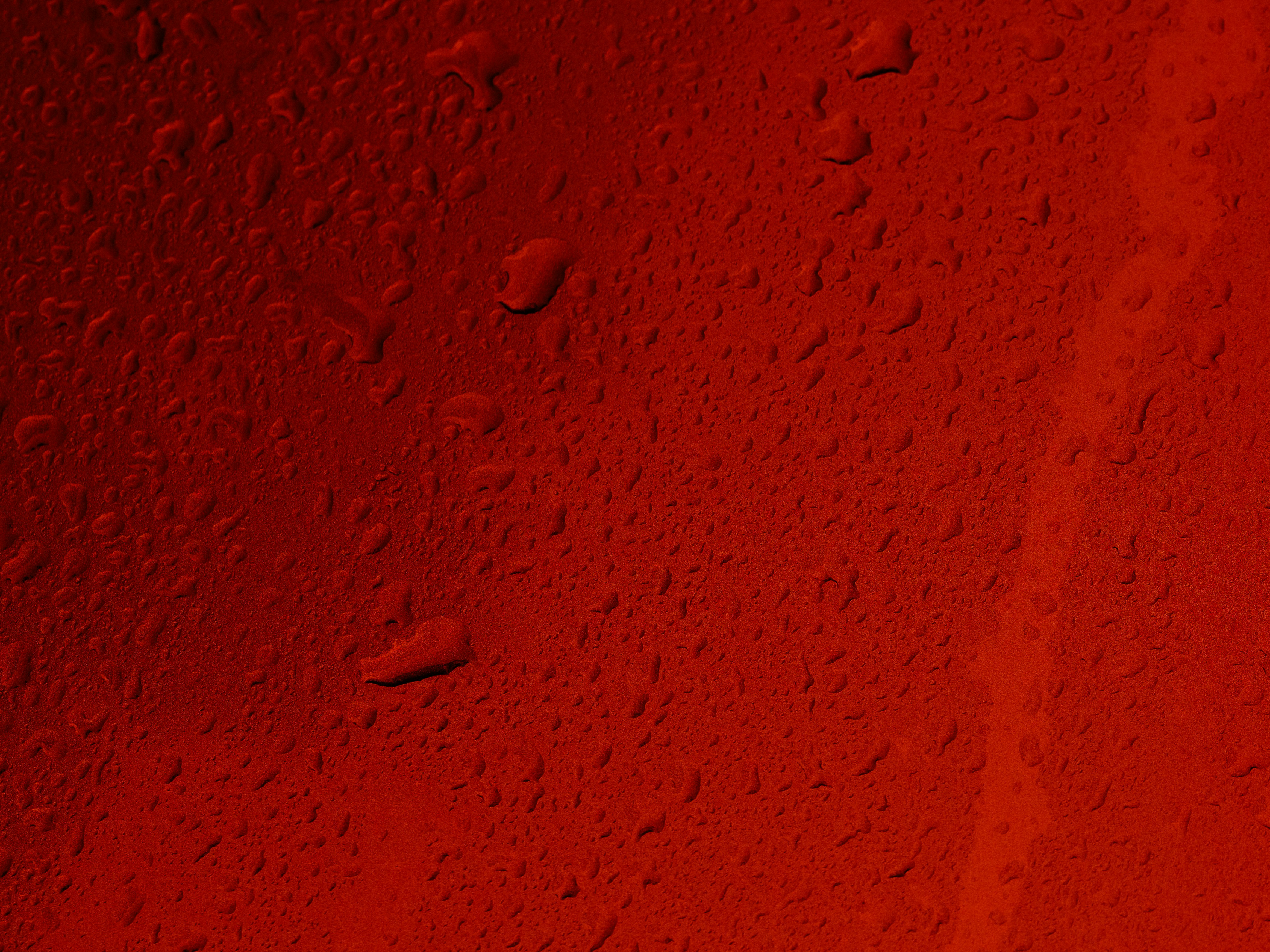 Crimson Moon: Textured Heat Rising Across a Worn Surface