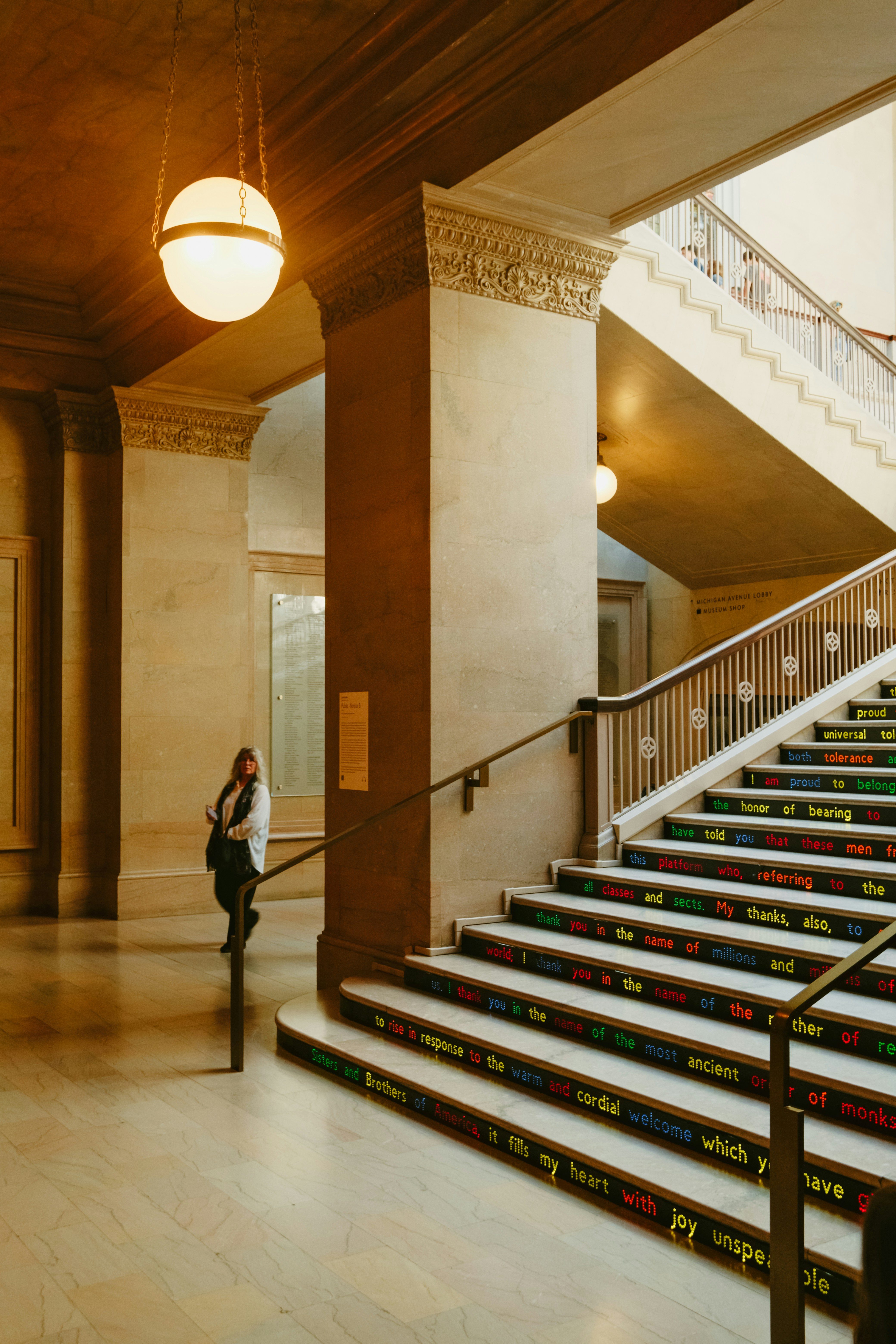 Glow of the Grand Staircase: A Quiet Moment by the Pillars