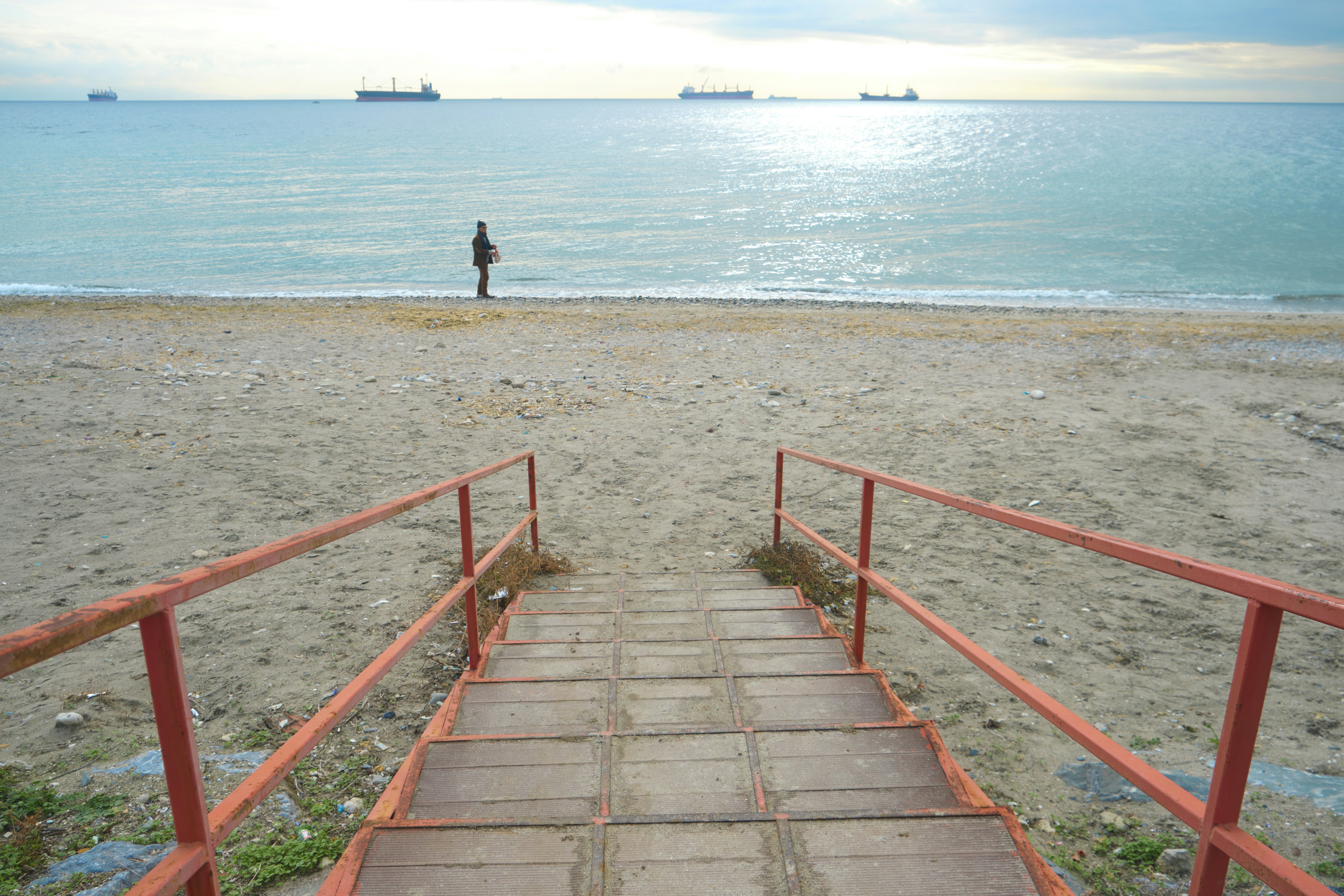 Path to the Quiet Sea: A Red-Railed Ascent to Horizon