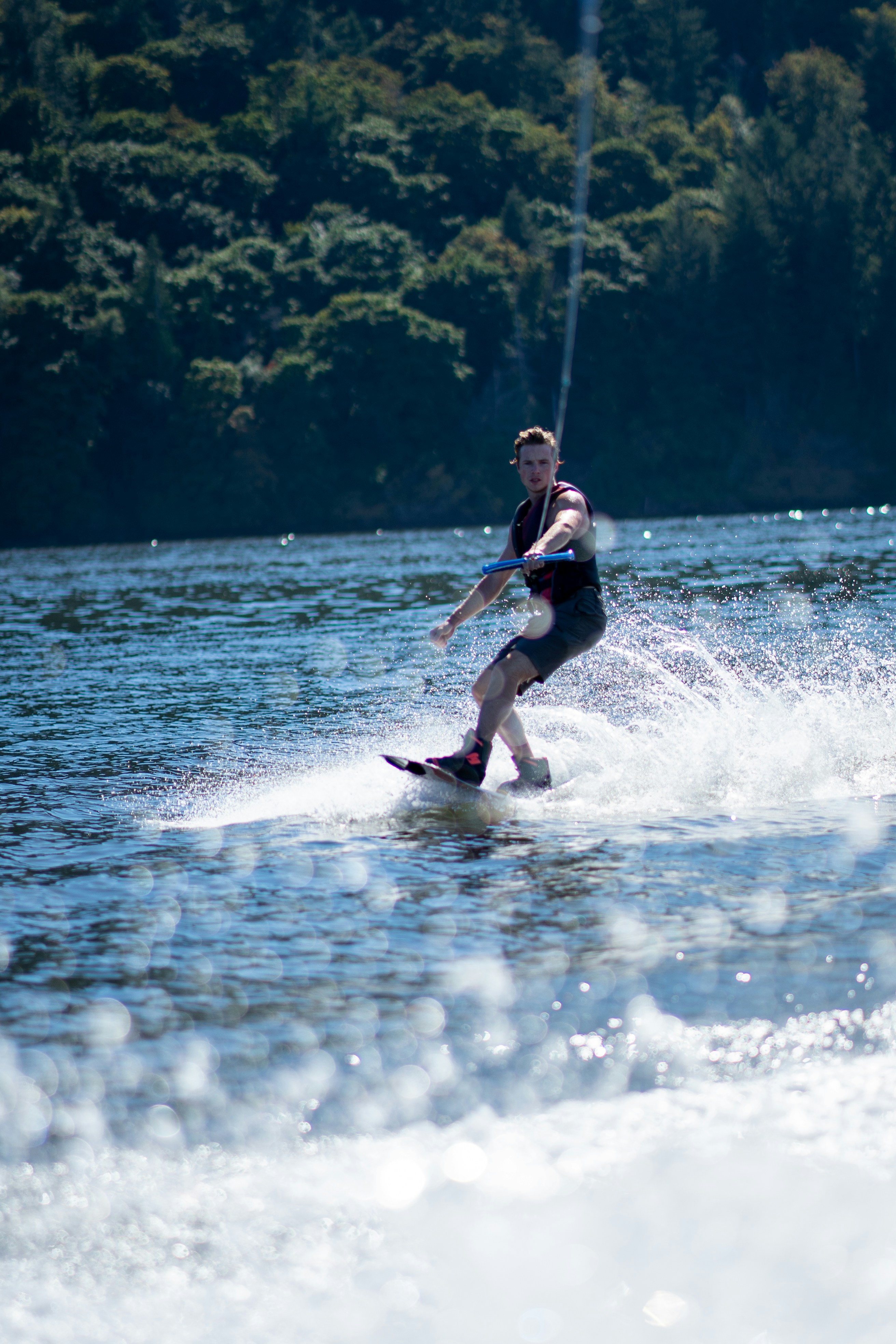 Hydrofoil Warrior: A Wakeboarder Carves a Crest on Glassy Water