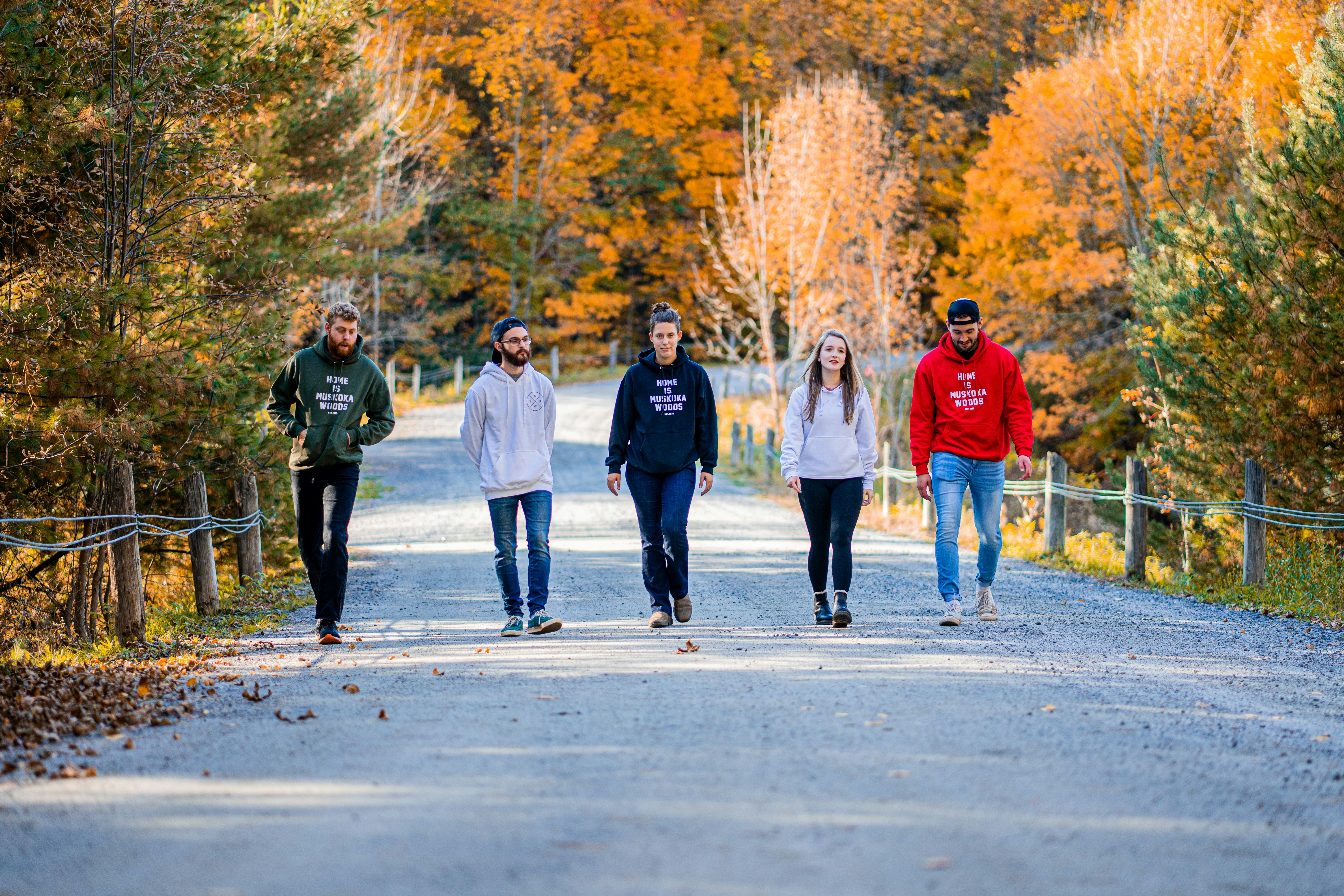 Five Friends Stirring Autumn Path, Feet Drifted by fallen leaves