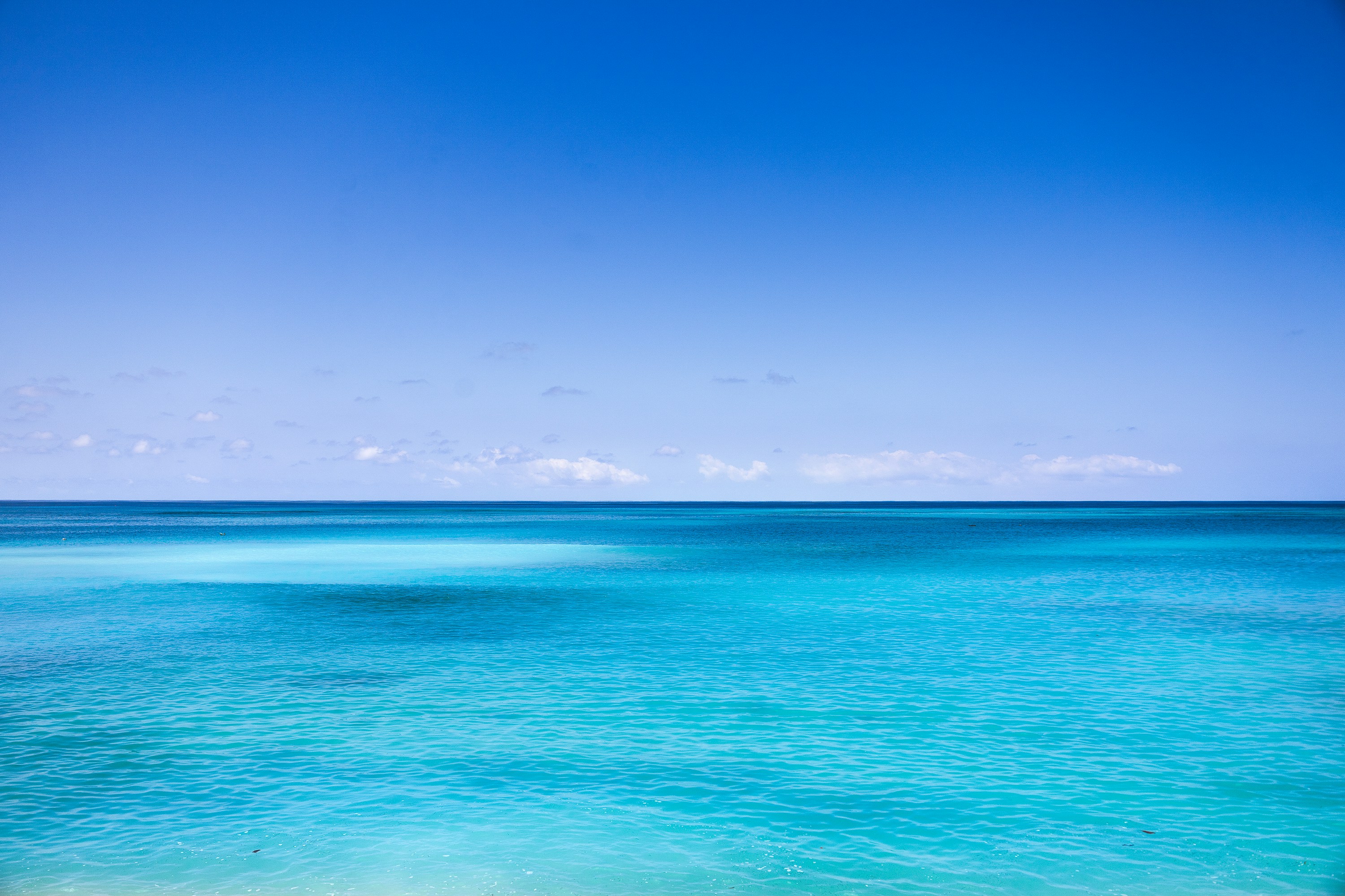 Azure Horizon: A Quiet Sea Meeting the Sky