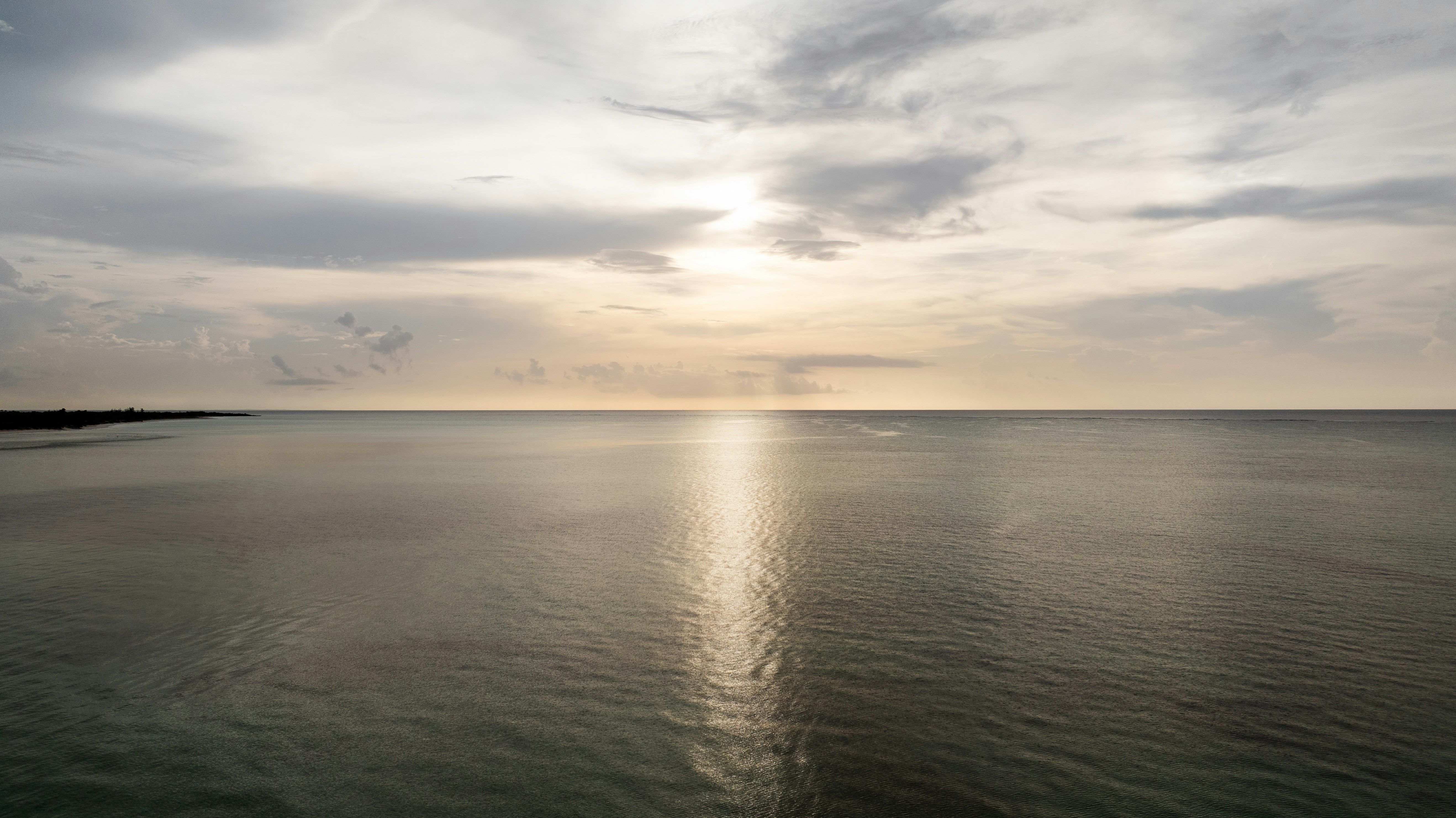 Quiet Horizon: Sunlit Path Across a Calm Sea