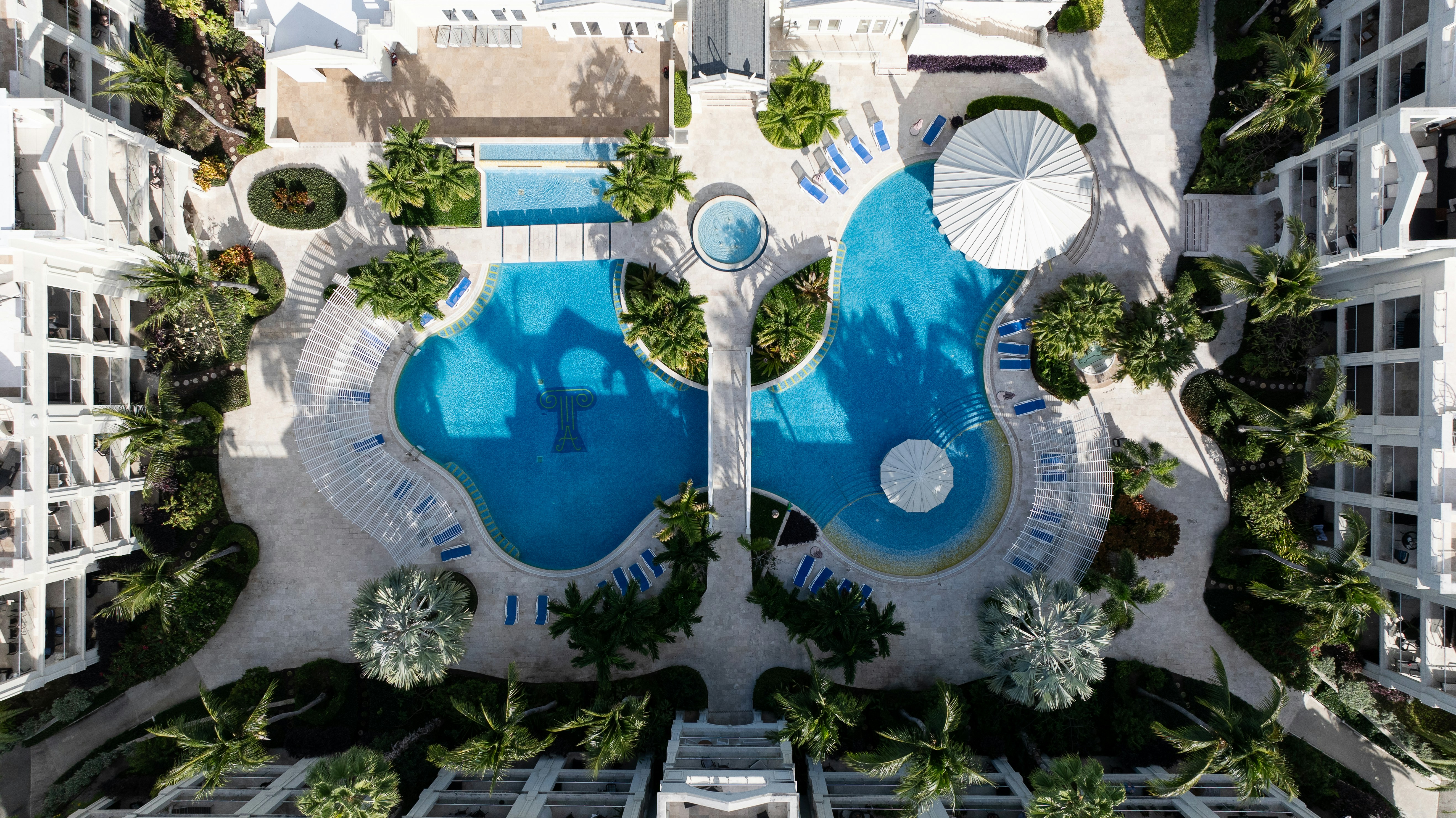 Aerial Symmetry: Twin Pools Framing a Central Courtyard