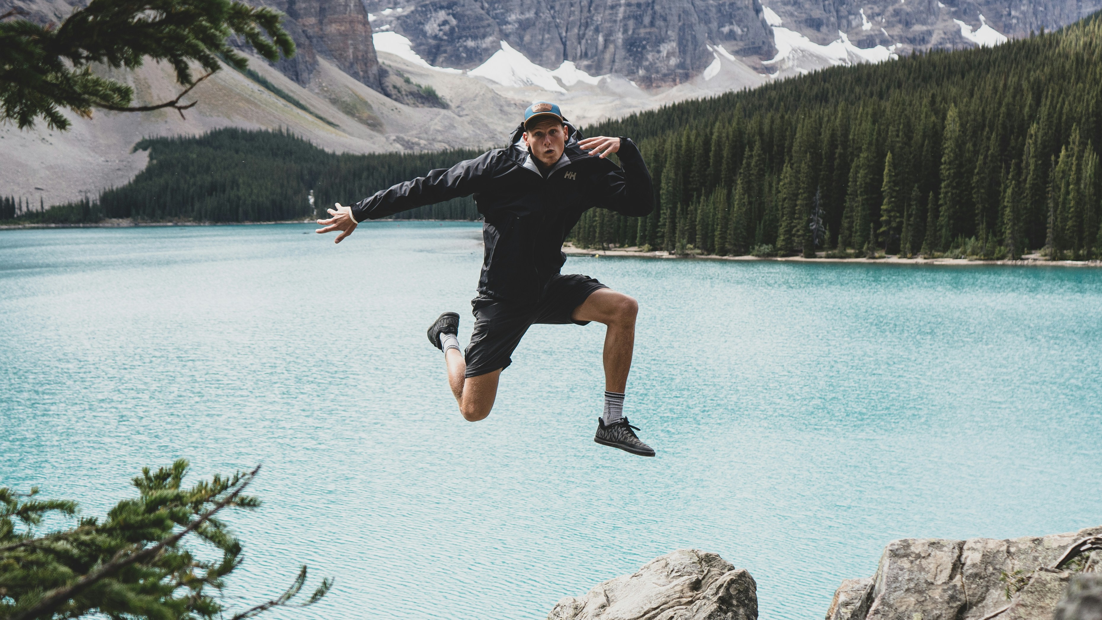Leap of Blue: A Mid‑Air Portrait Over Turquoise Waters