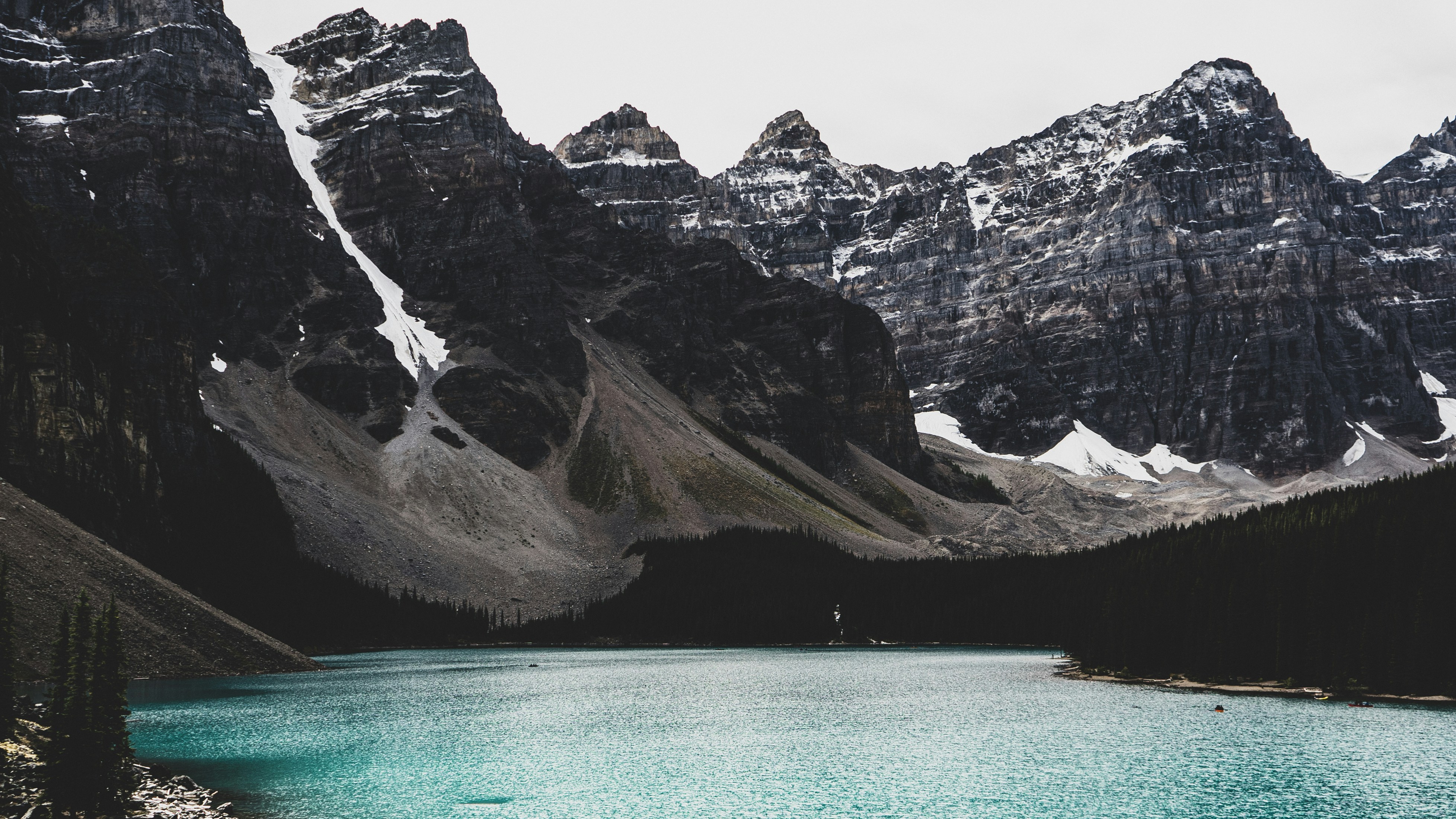 Glacial Mirror: Turquoise Lake Between Rugged Peaks