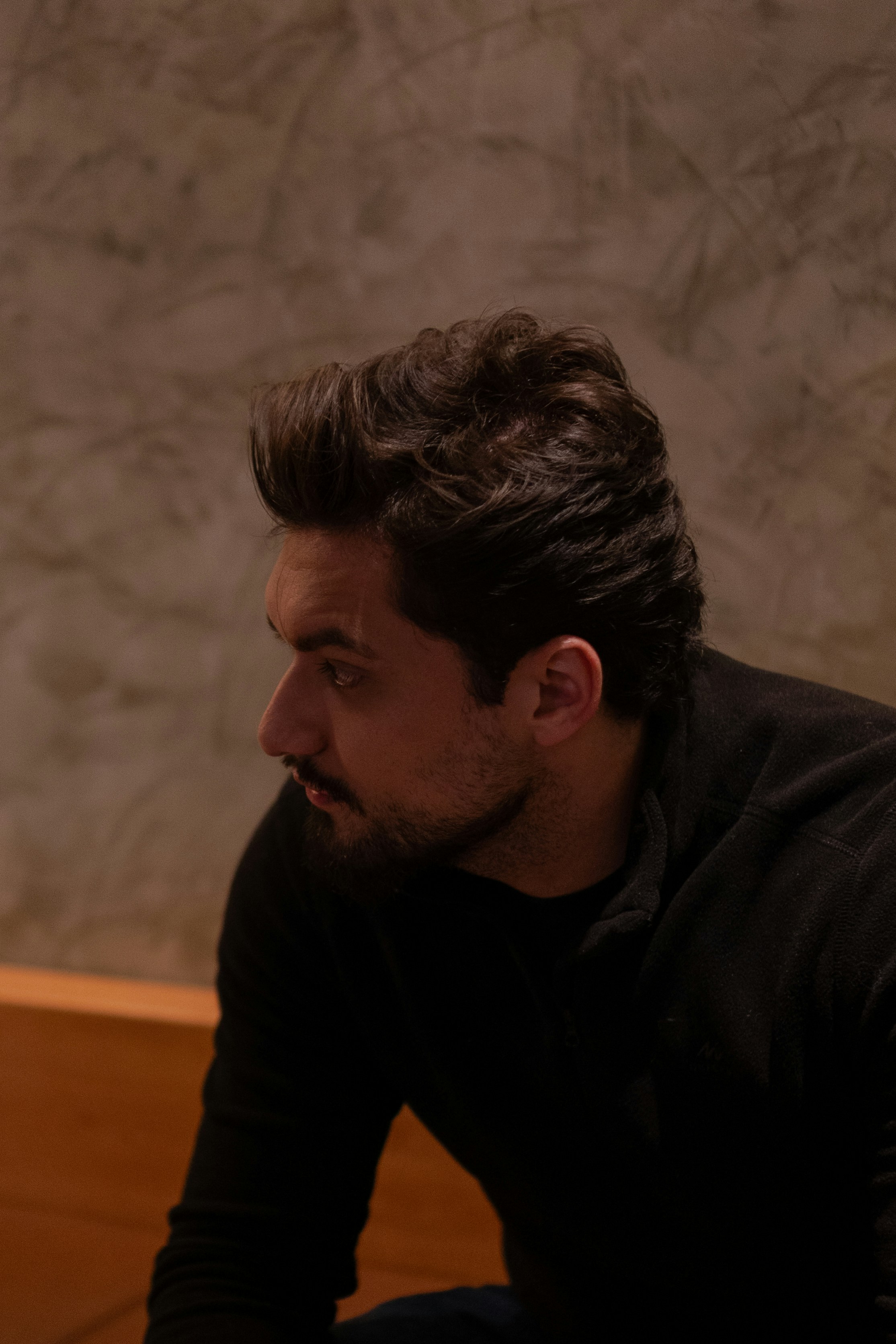 Midnight Pondering: A Stylized Profile in Warm Studio Light