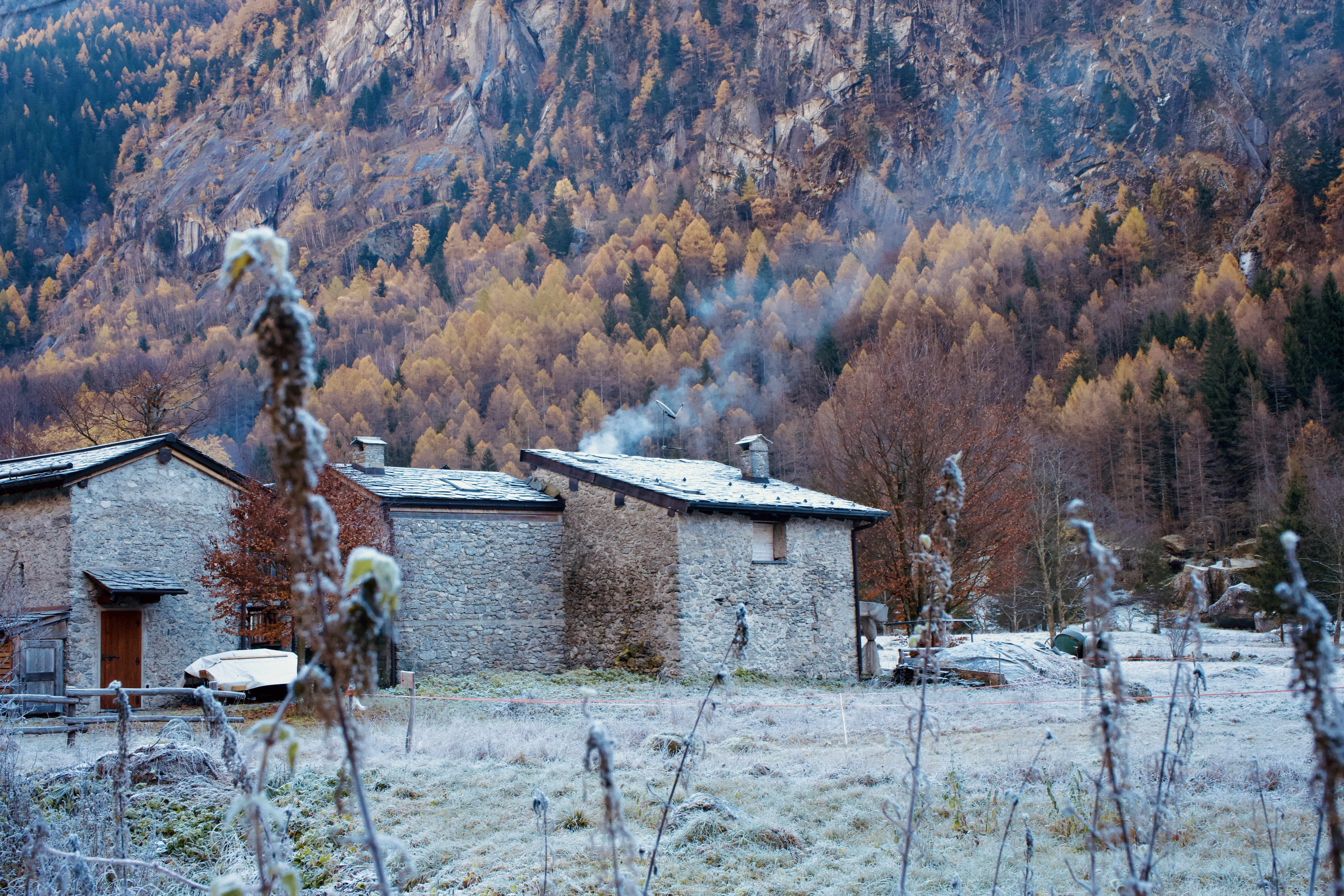 Frost-Covered Hamlet Amid Autumn Hills