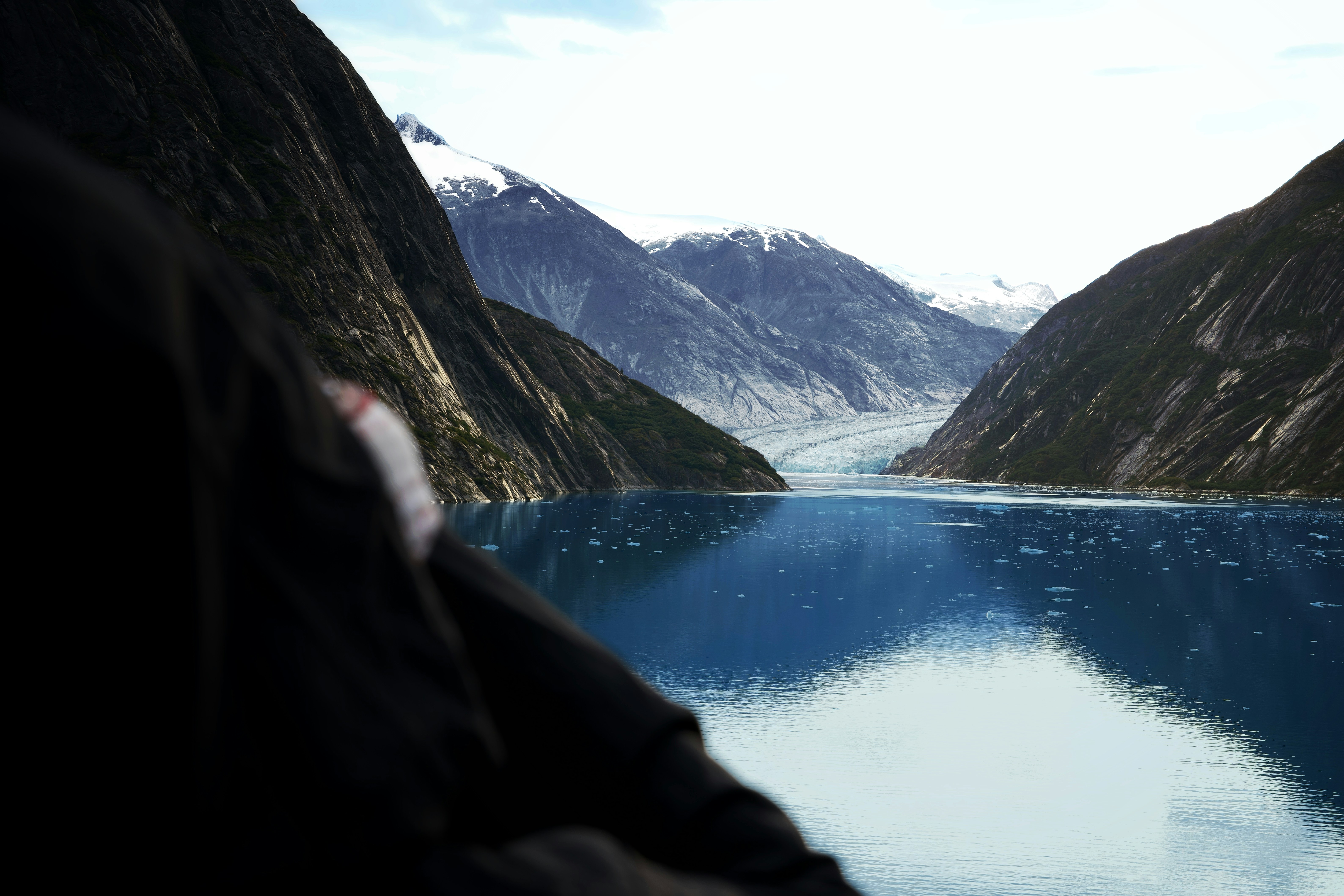 Glacial Fjord Gate: A Dark Frame to Blue Silence