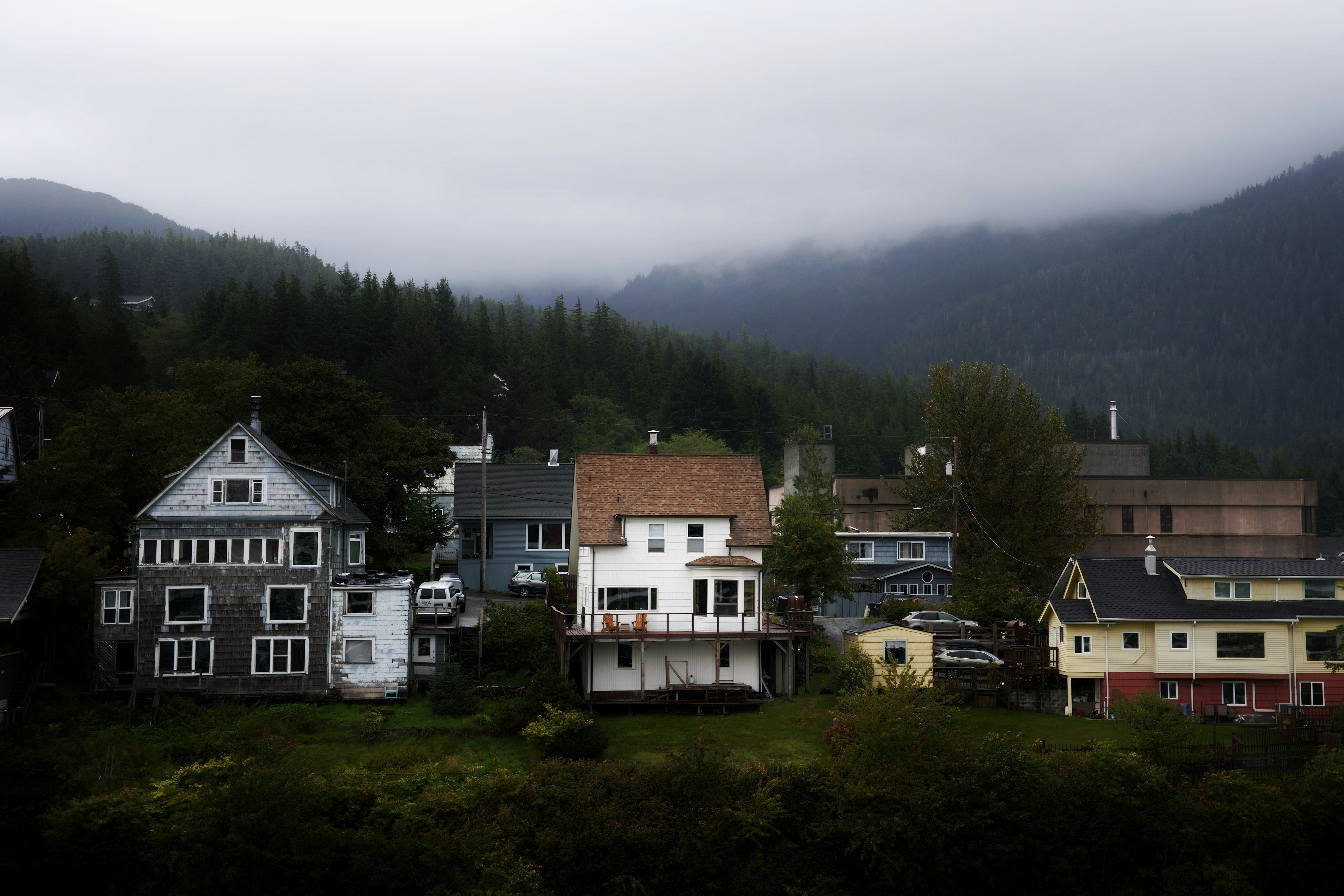 Fog-Laced Village Beneath Silenced Peaks