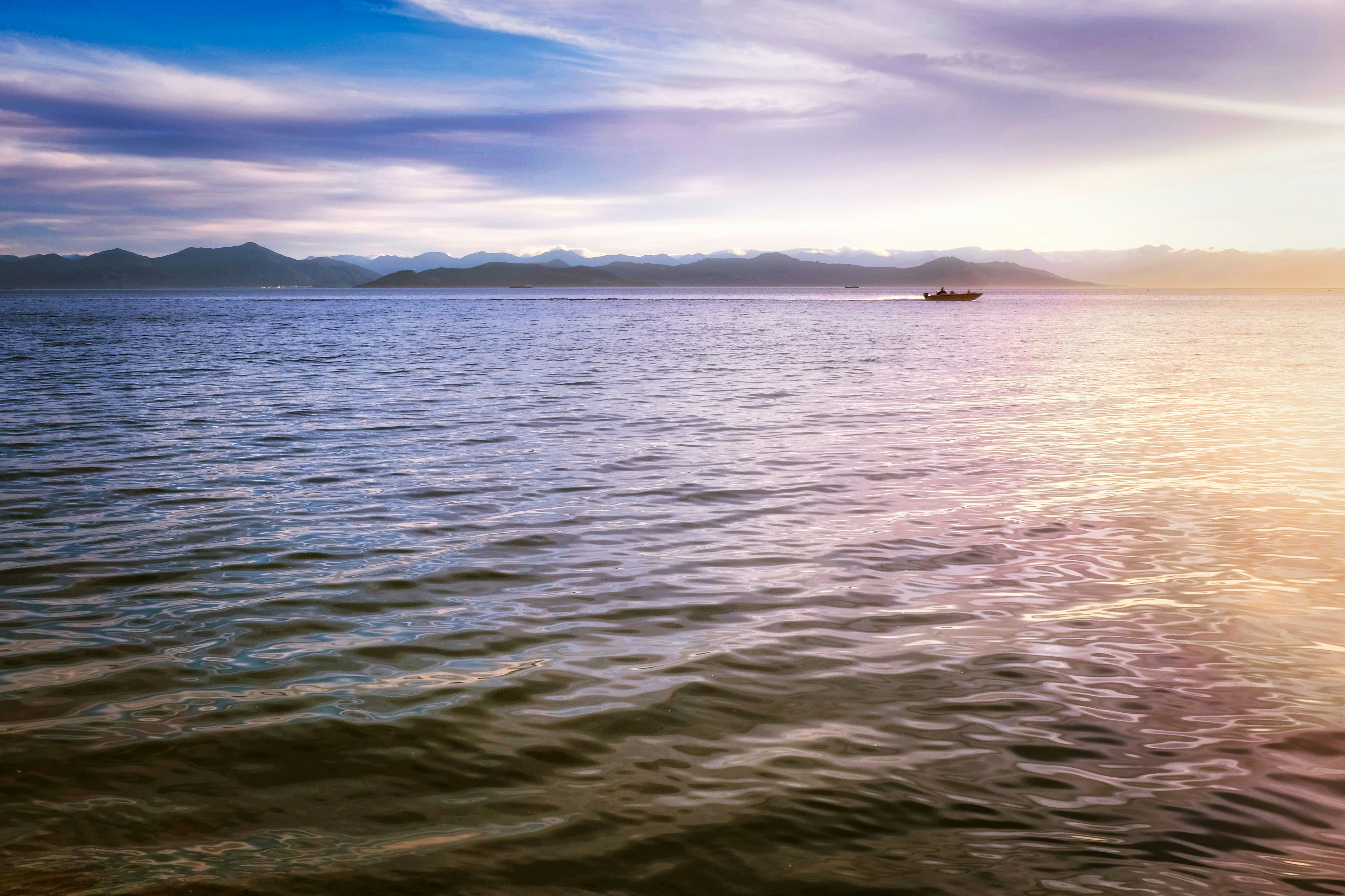 Sunlit Horizon Over Serene Waters