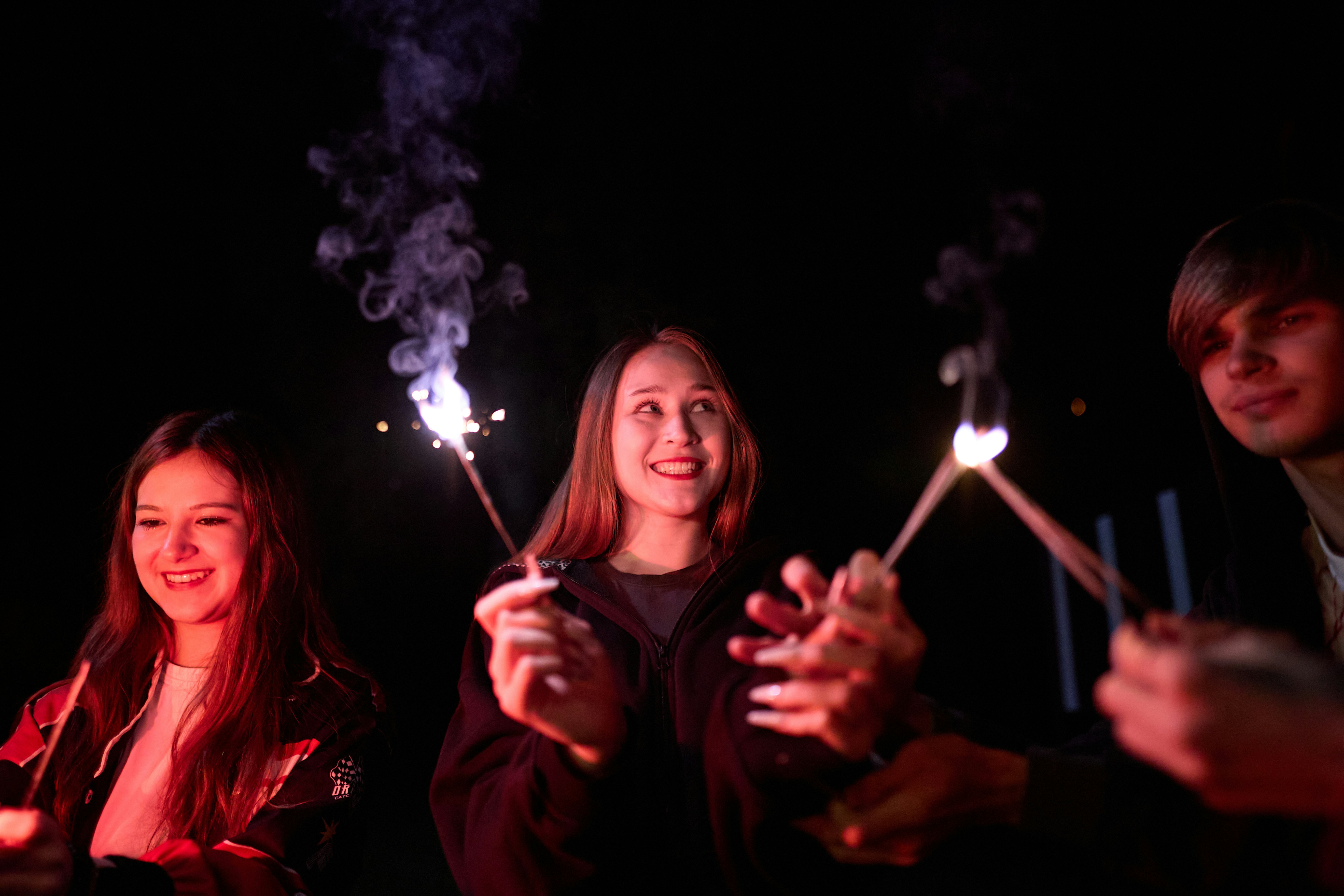 Midnight Sparks: Friends Share Firework Glow