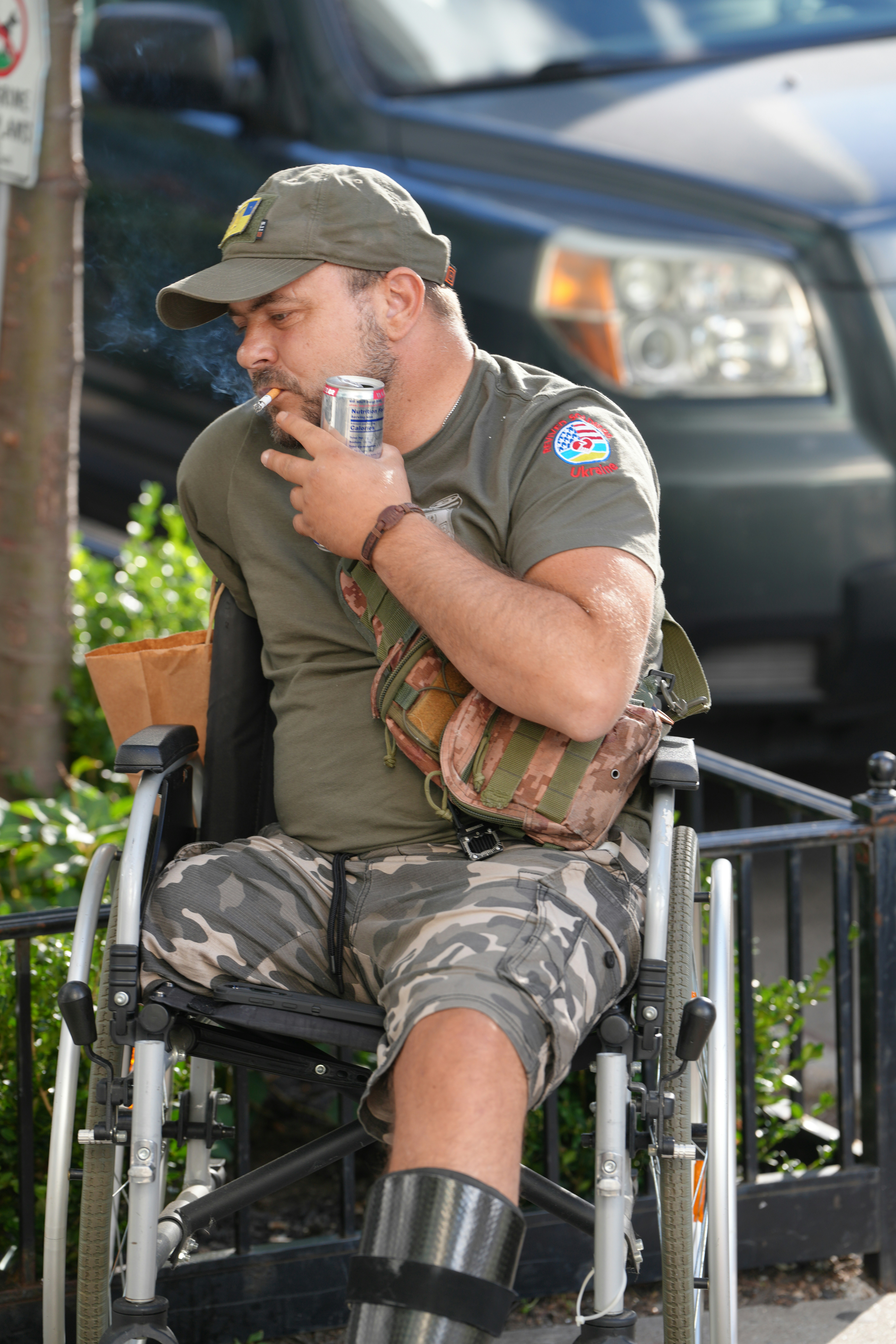 A Quiet Moment in Camouflage: Cigarette Break on Wheels
