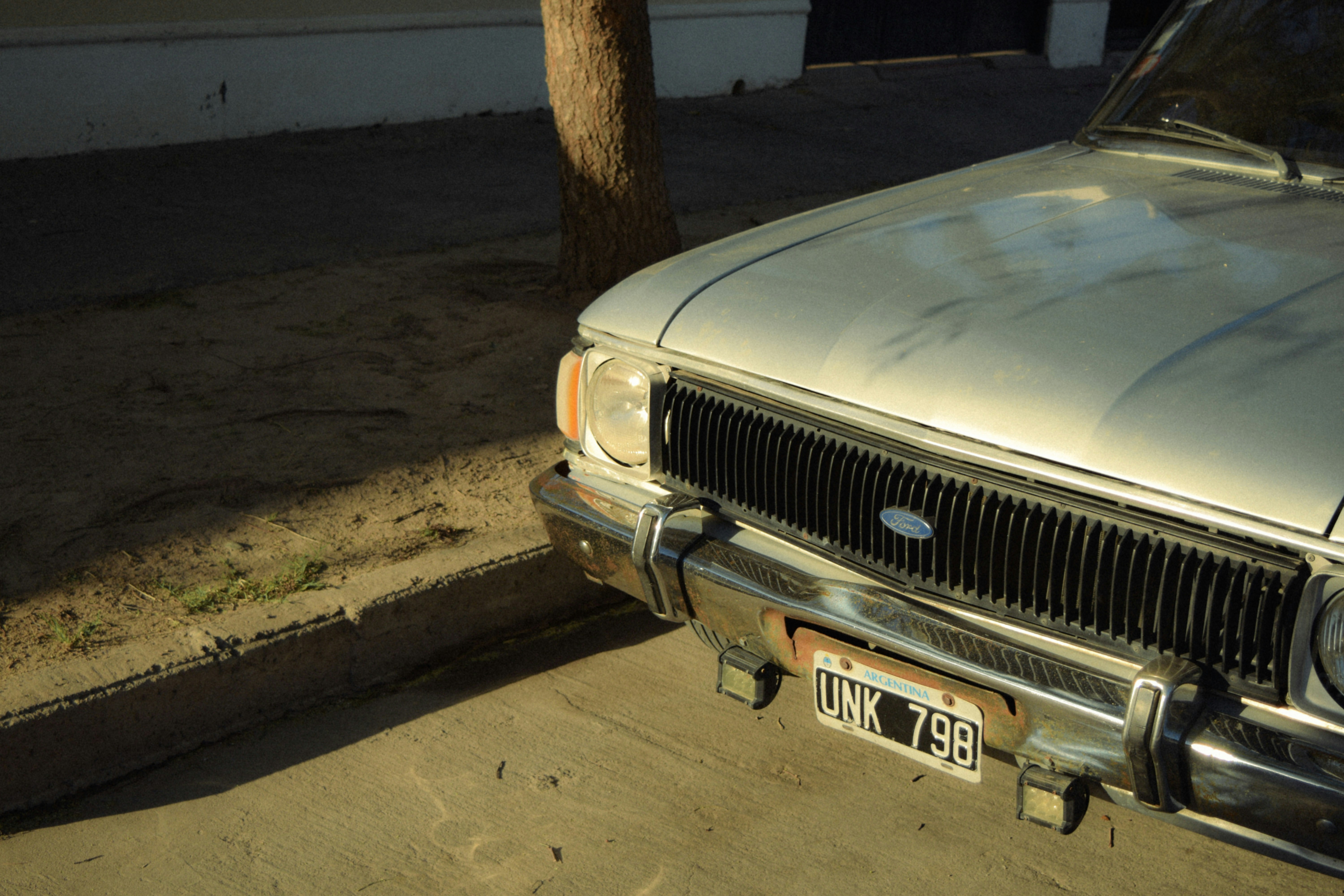Chrome Grille and Vintage License: A Quiet Parked Moment