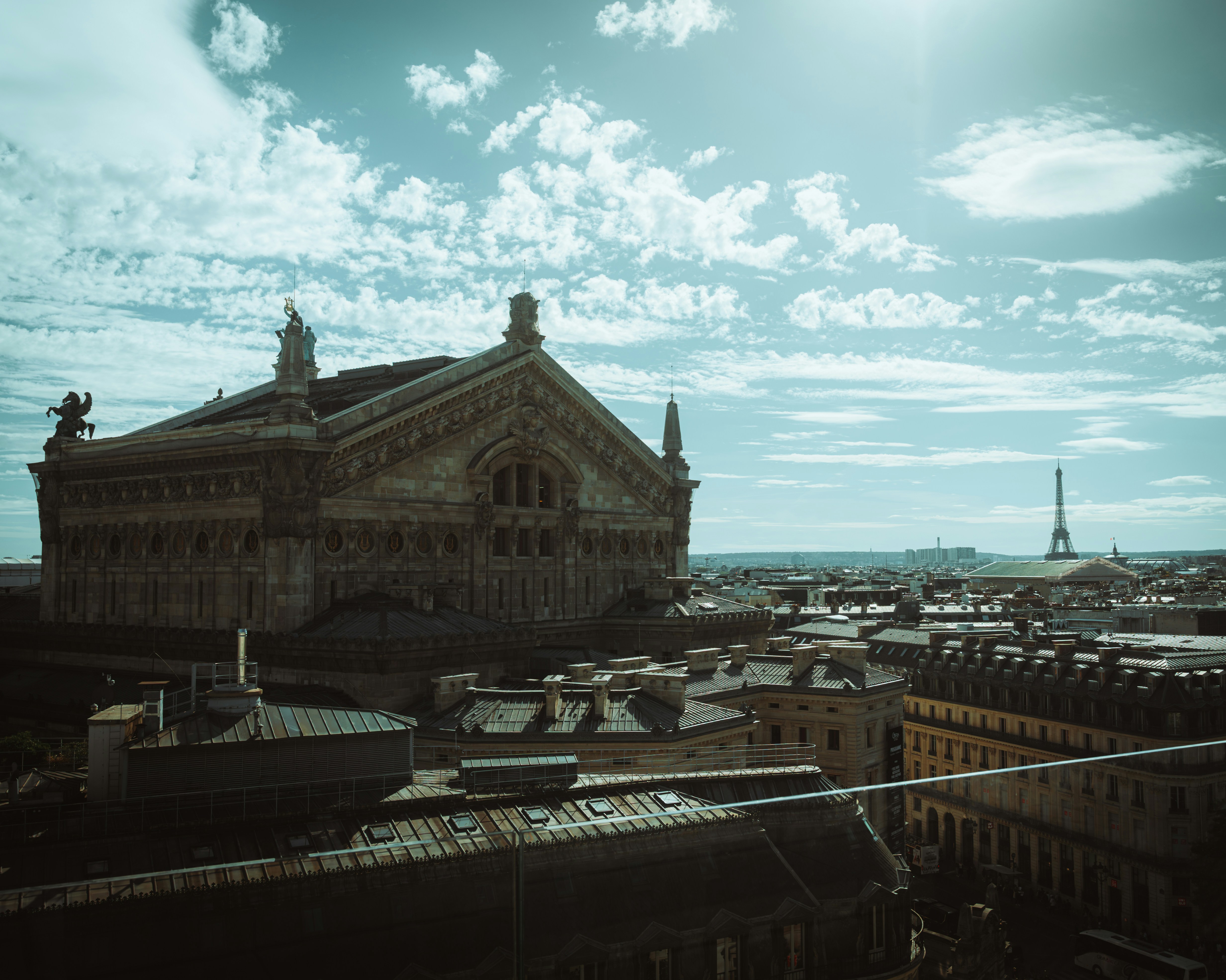 Parisian Rooflines and a Gilded Facade Under a Bright Sky