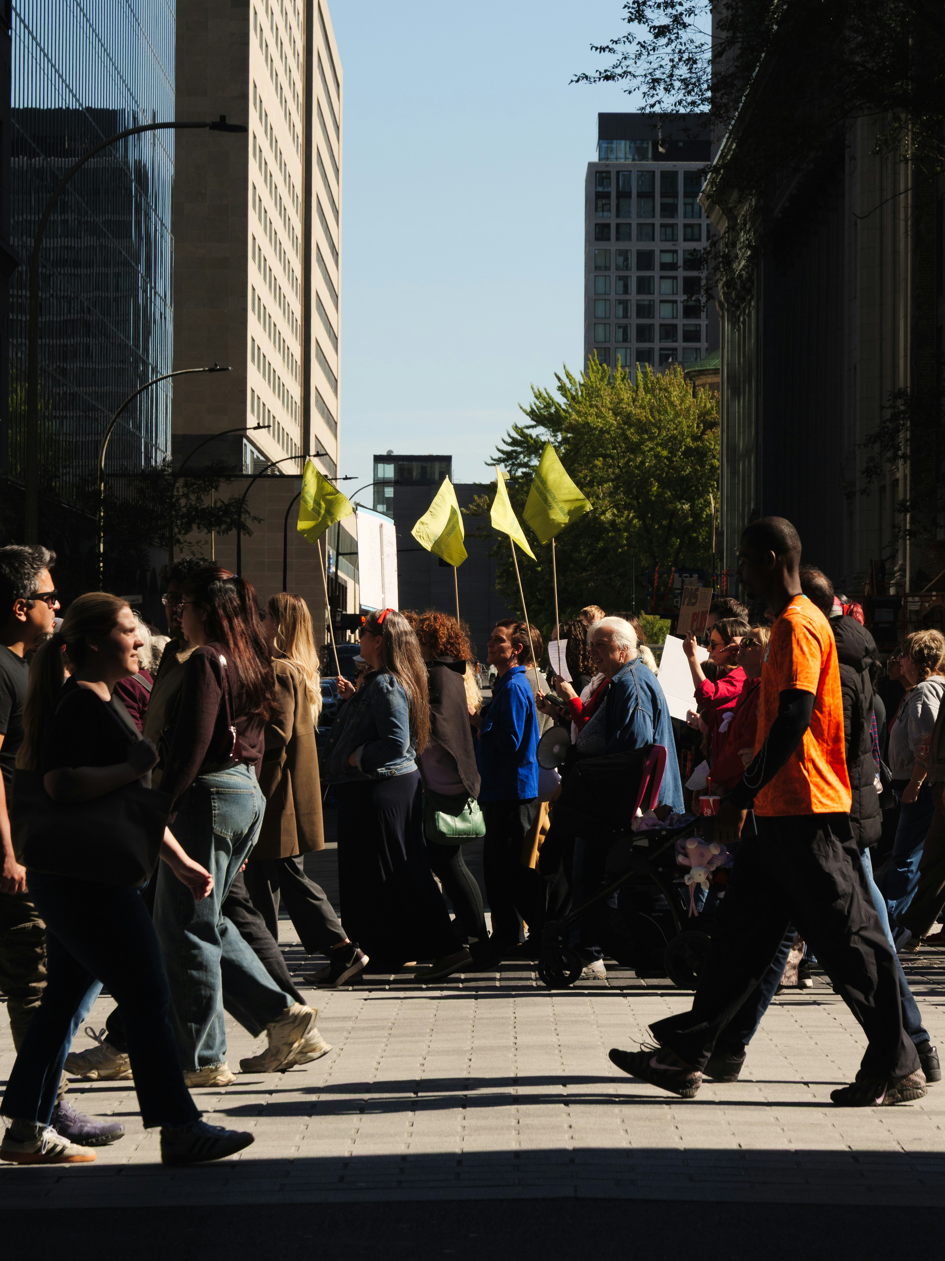 City March: Yellow Flags Amid the Crowd