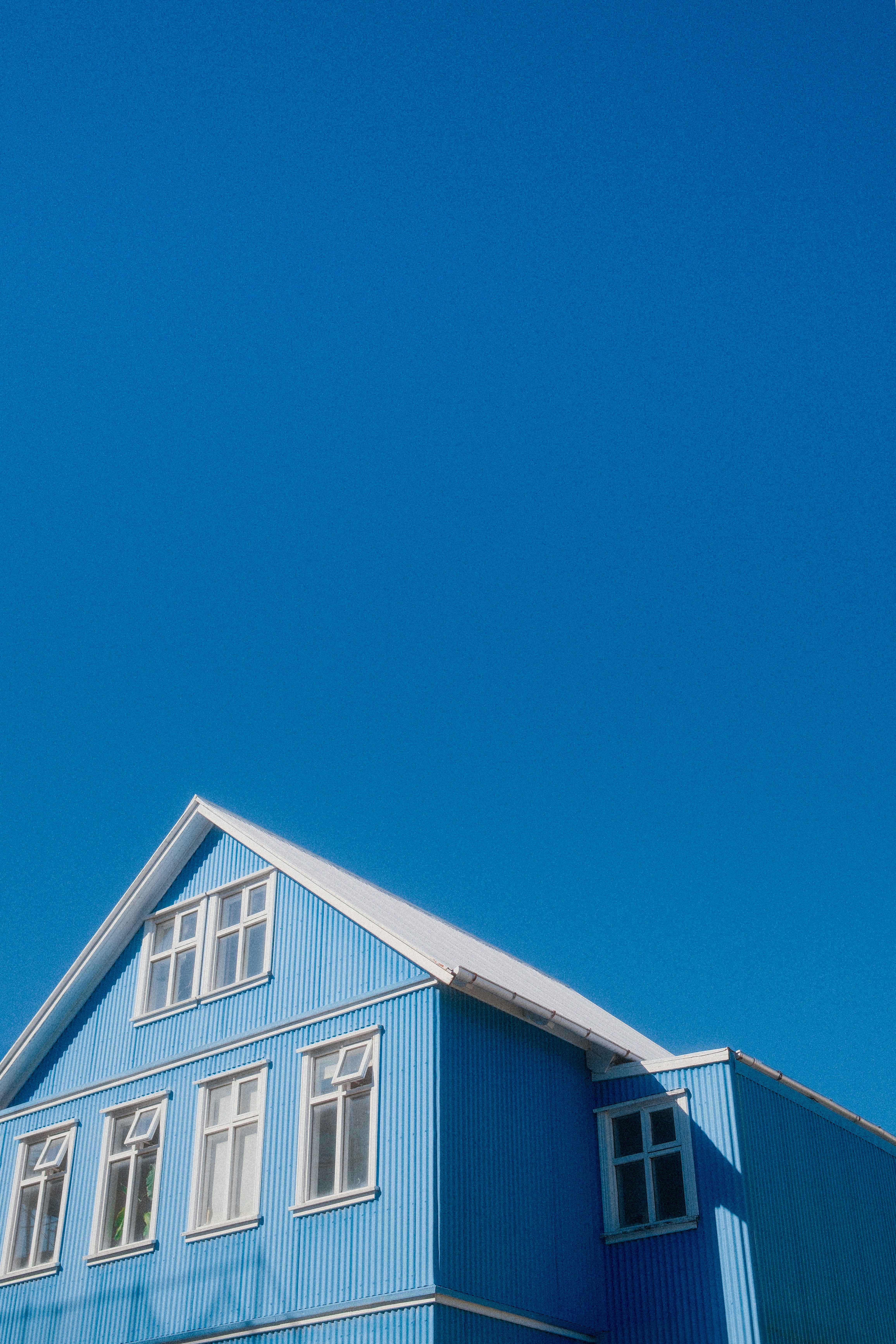 Azure Gable: A Corner of Blue in Crisp Sky