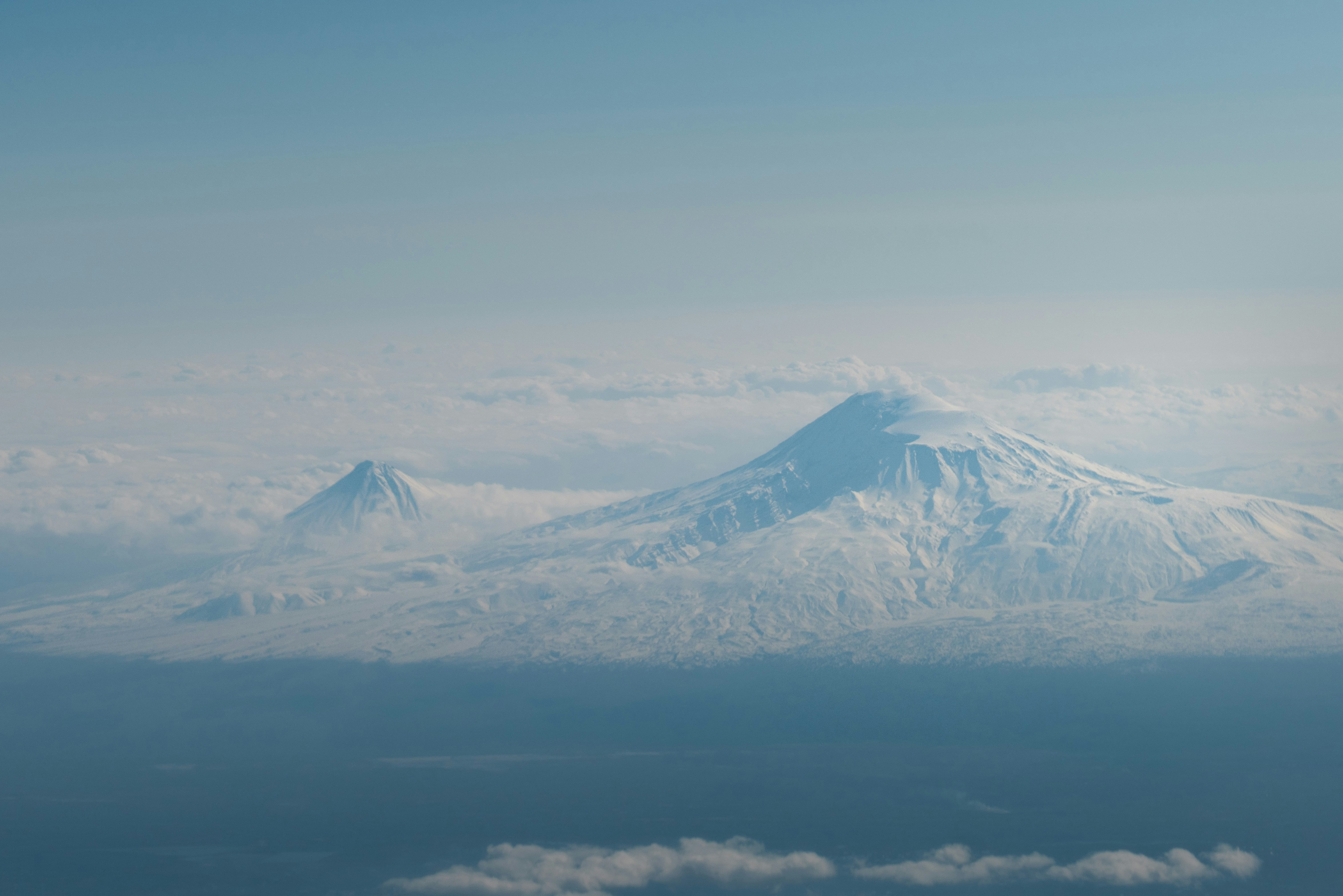 Snowbound Peaks Quiet Above a Sea of Clouds