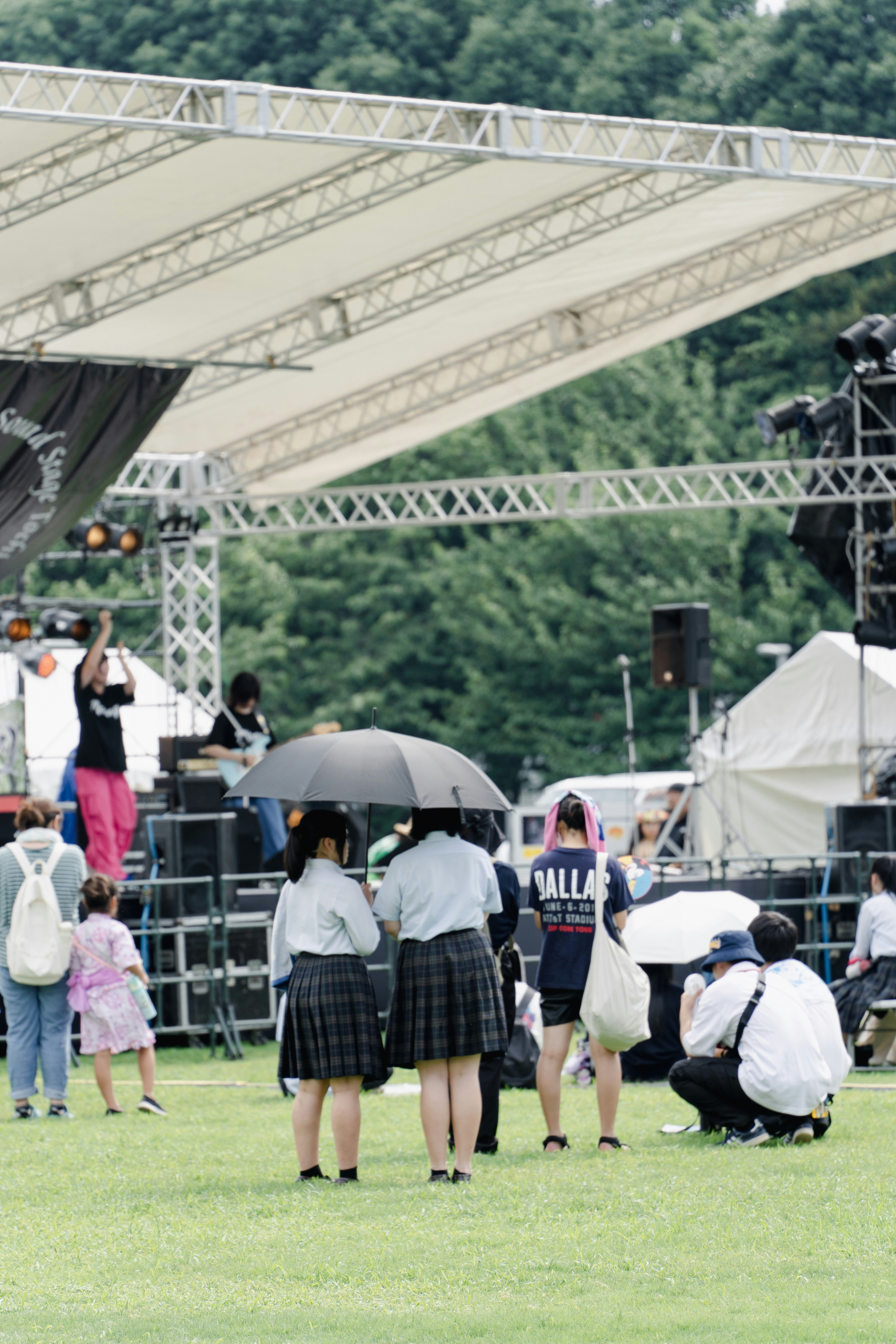 Audience under a canopy: a festival moment at the open-air stage