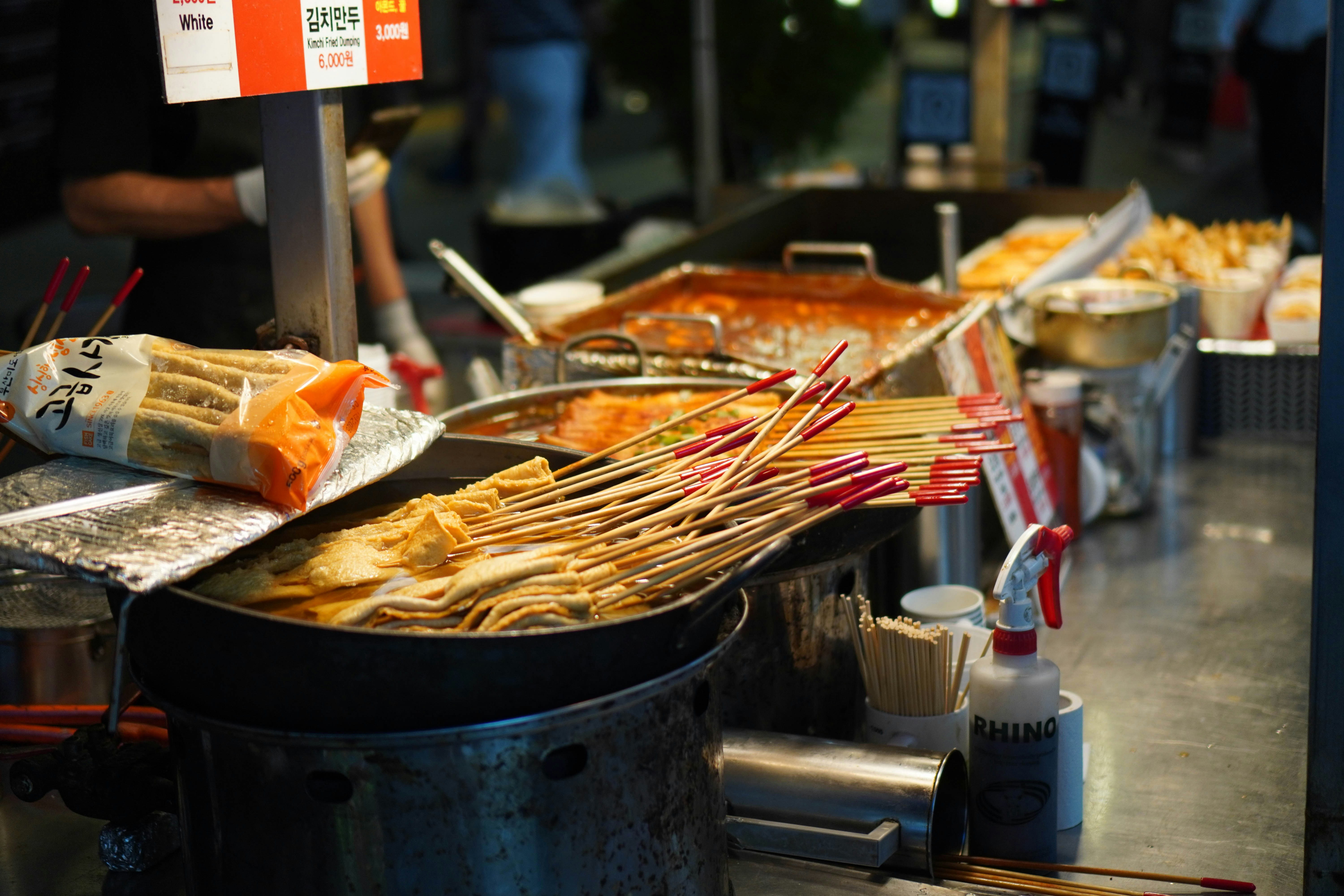Skewered Sizzle: Street Grill With Skewers and Saucy Steam