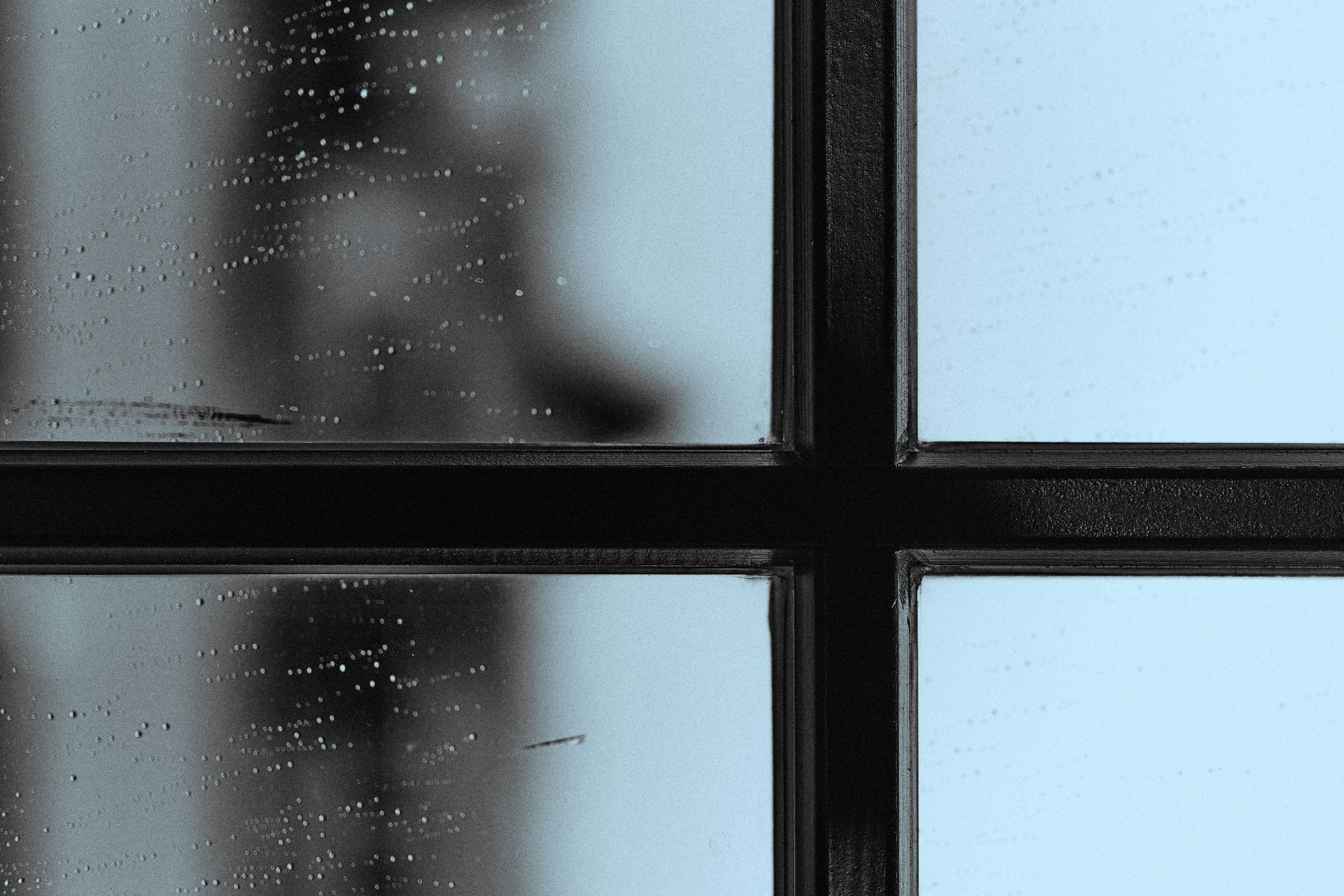 Crossed Grids: Rainy Window Panes in a Quiet City