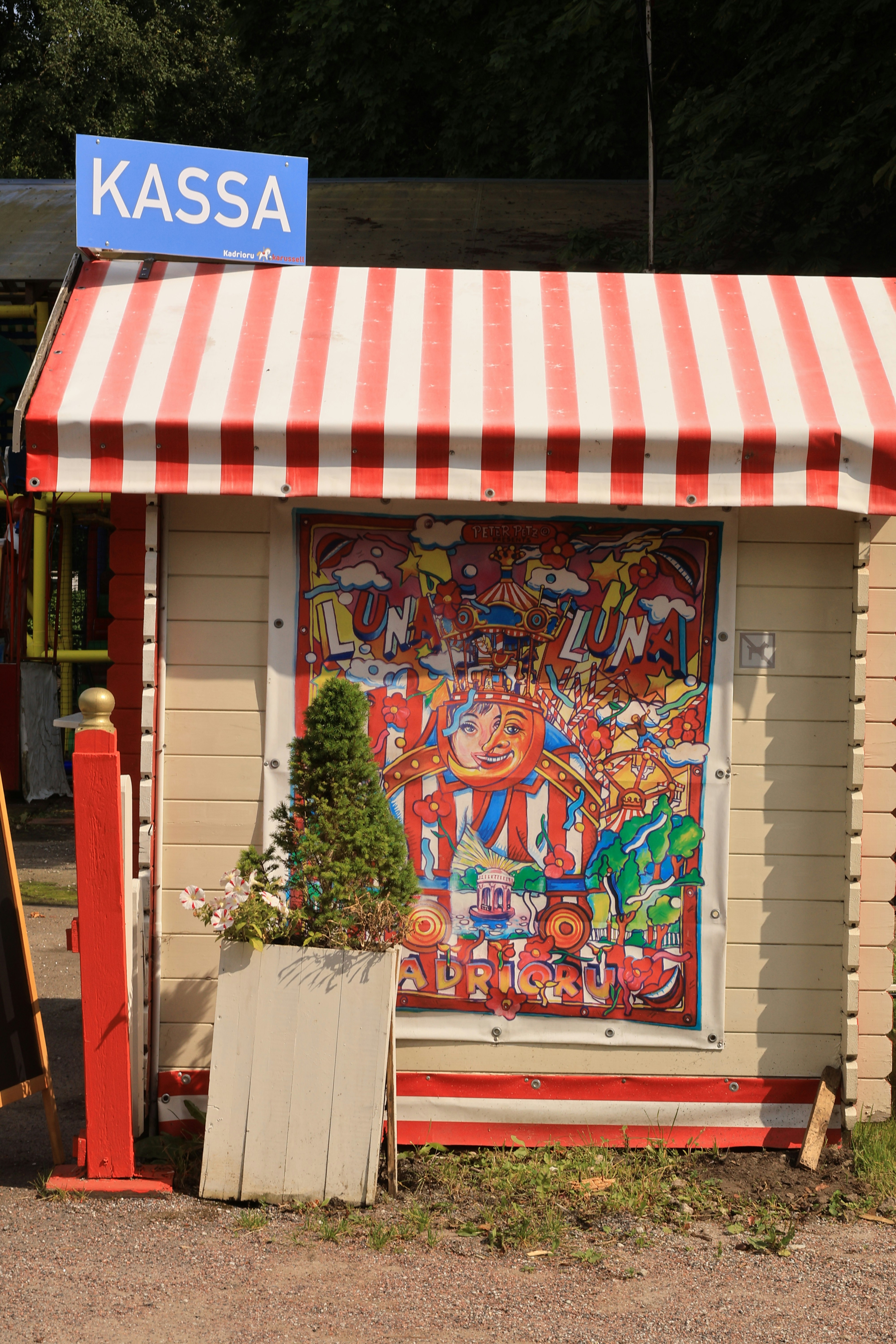 Carnival Booth with Striped Canopy and Vivid Poster