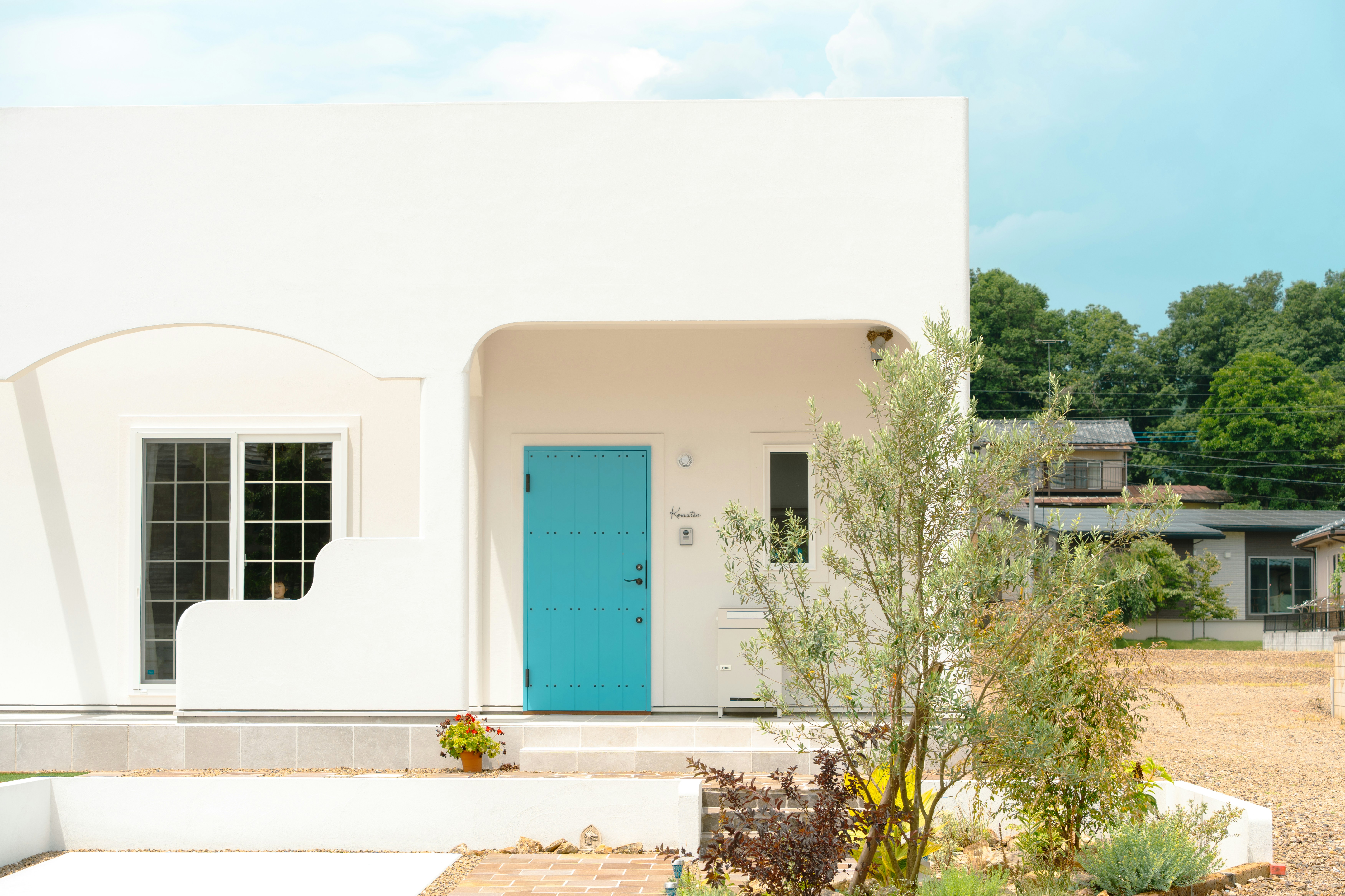 Azure Doorway on a Sunlit Modern Facade
