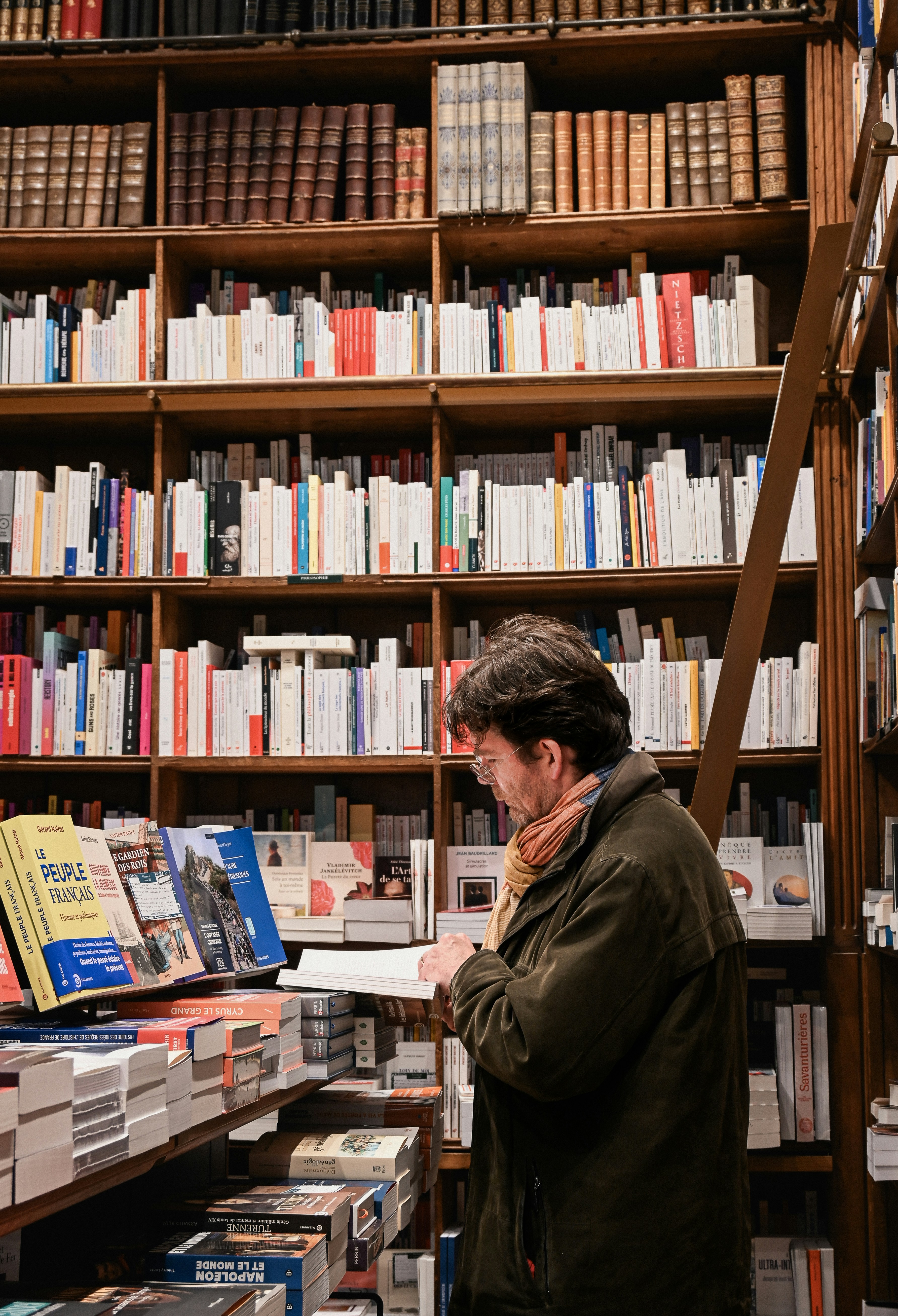 Reader in a Loft of Books: Pages and Portraits Amid Shelves