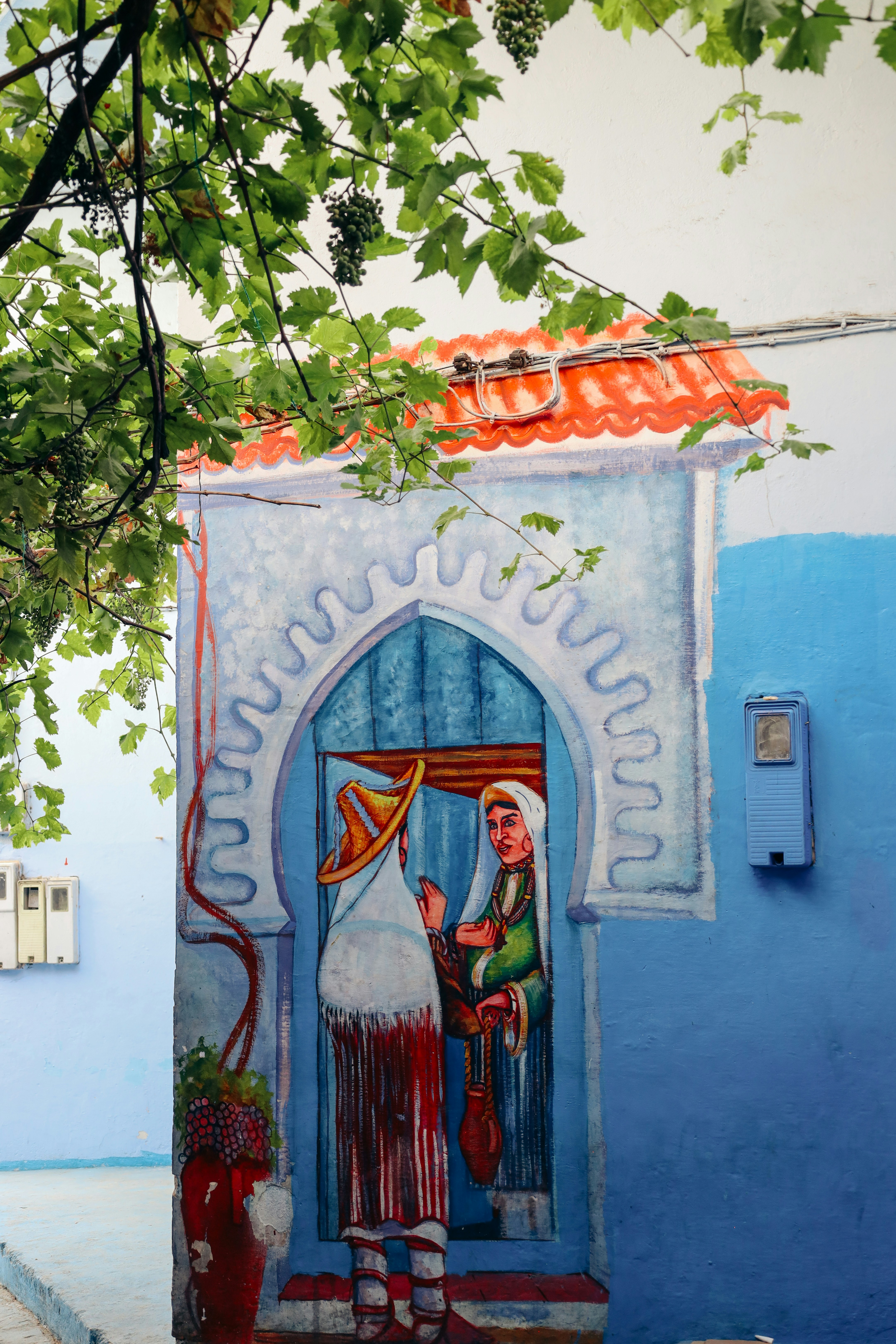 Blue Courtyard Doorway: A Gaze Into Colorful Murals