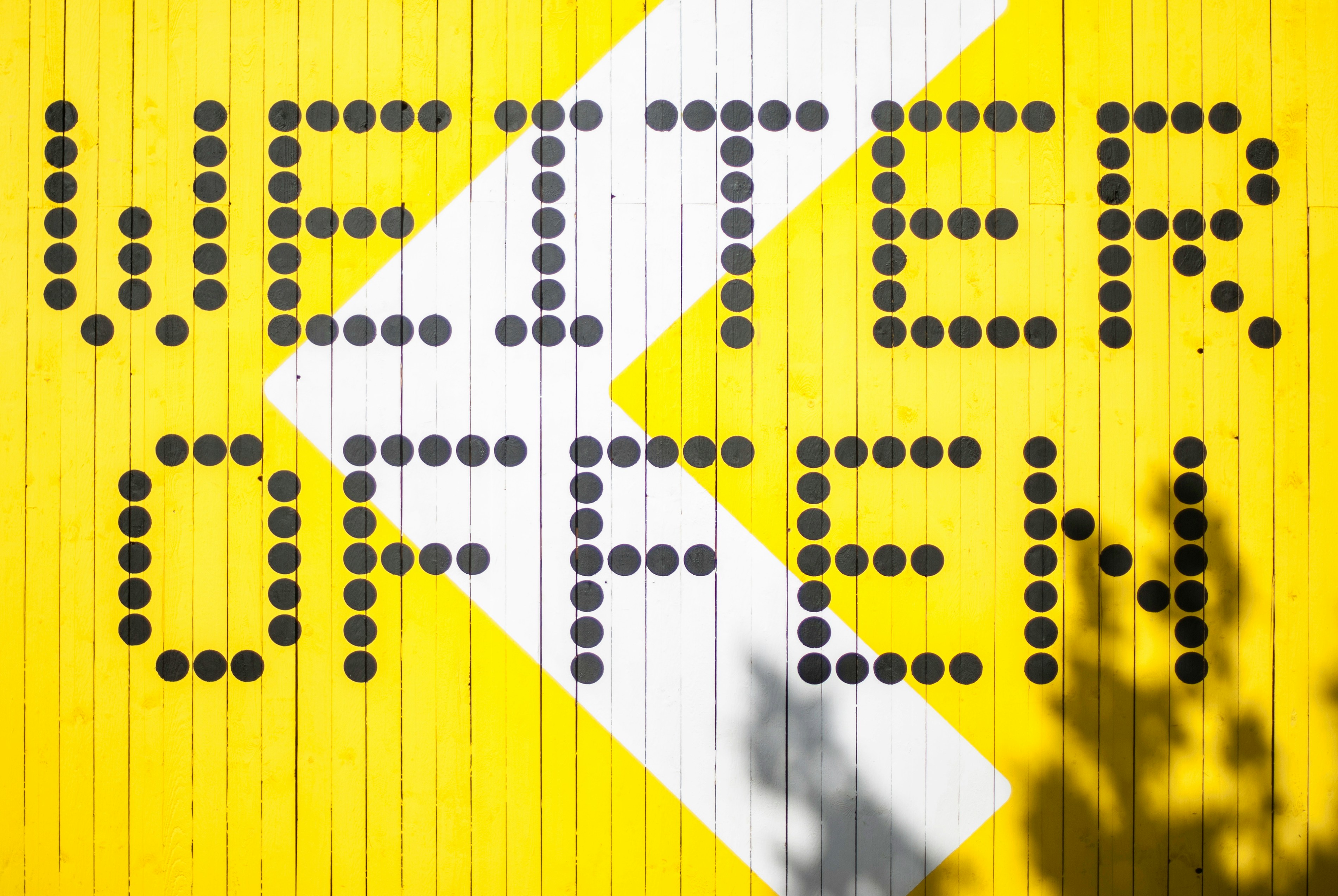 Dots and Duty: The Yellow Wall Signaled with Shadowed Text