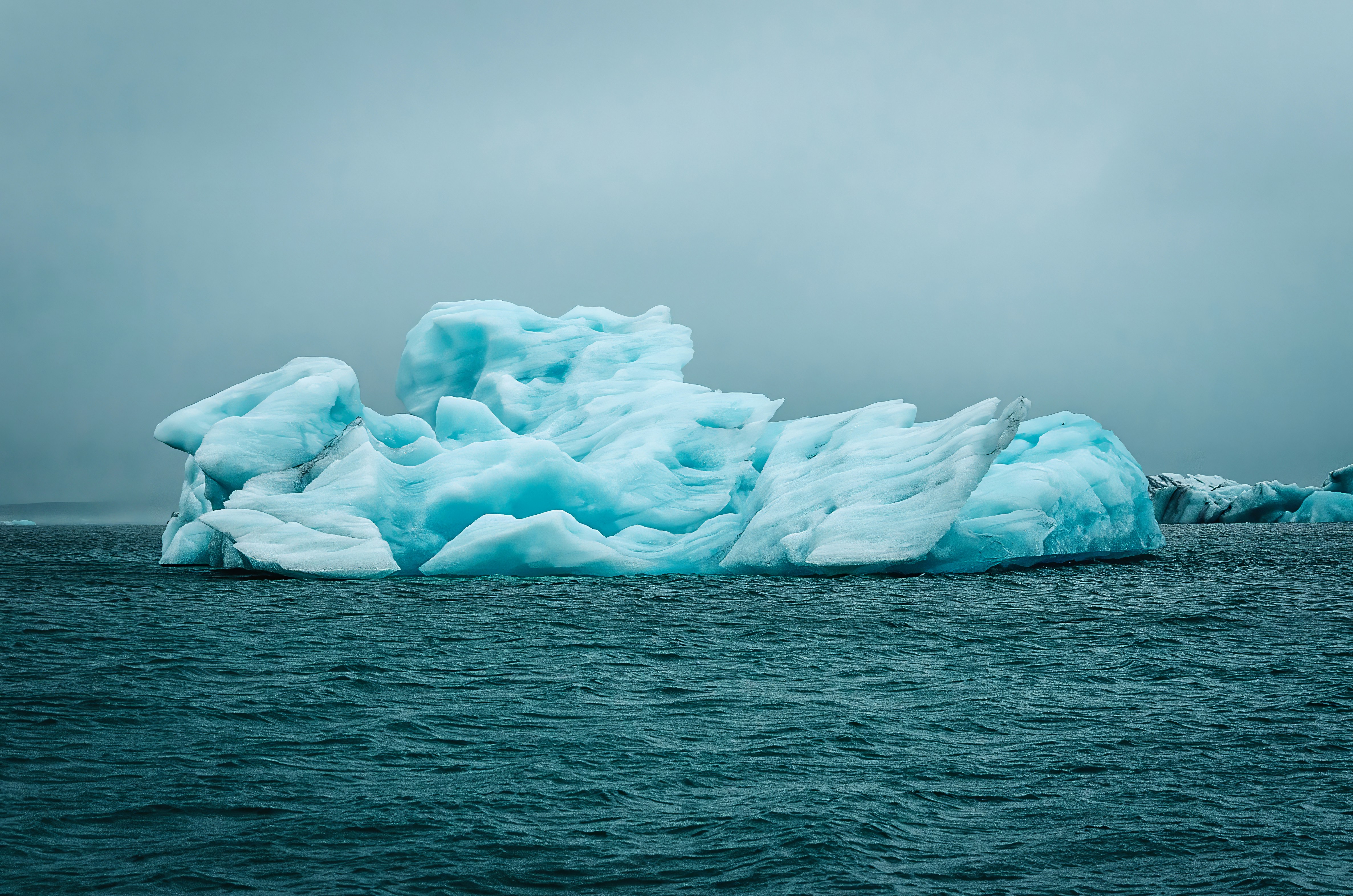 Glacial Sentinel: Iceberg Resting on a Quiet Ocean