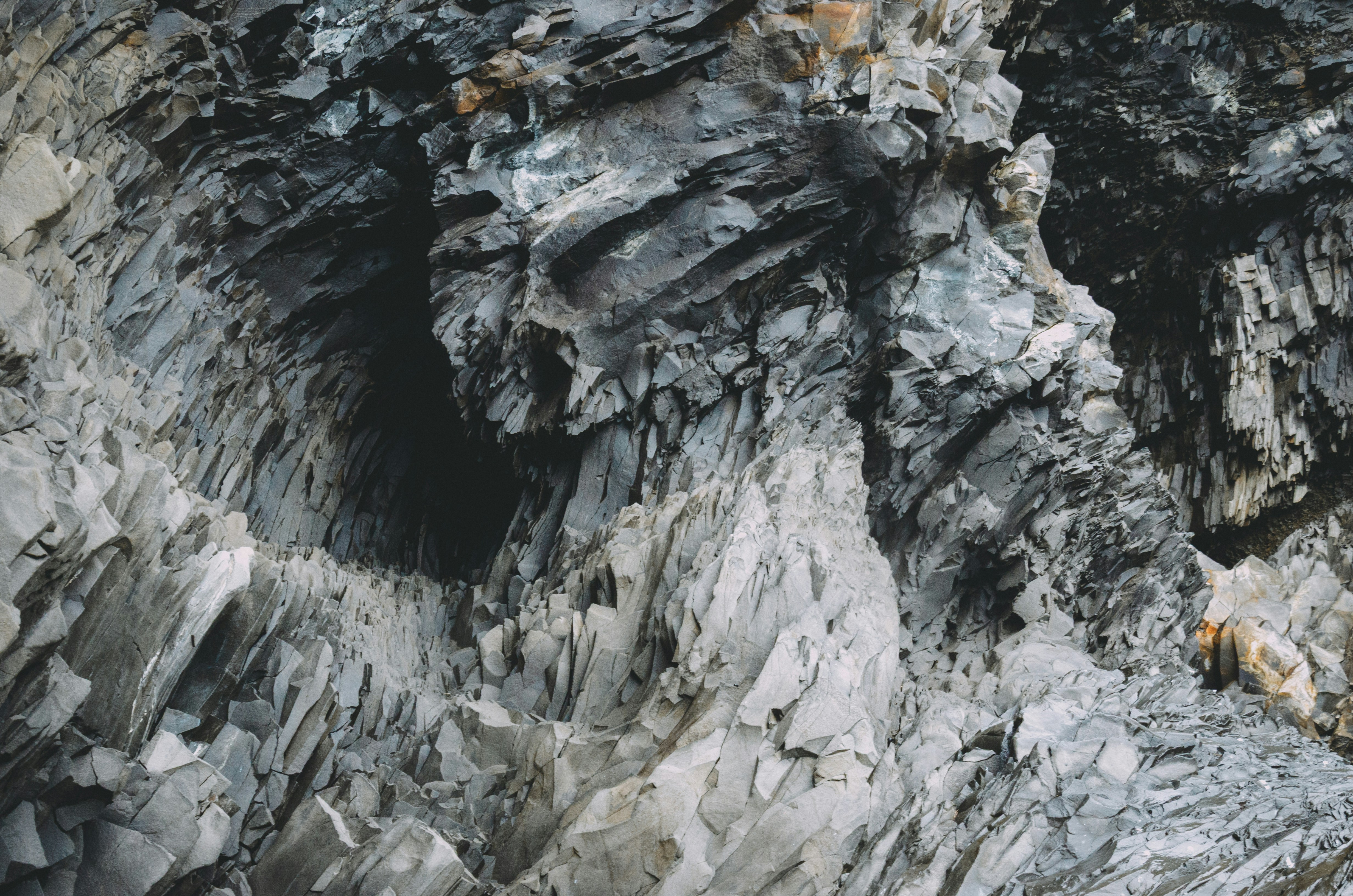 Geometric Coast: Carved Rock Wall Receding into Shadow