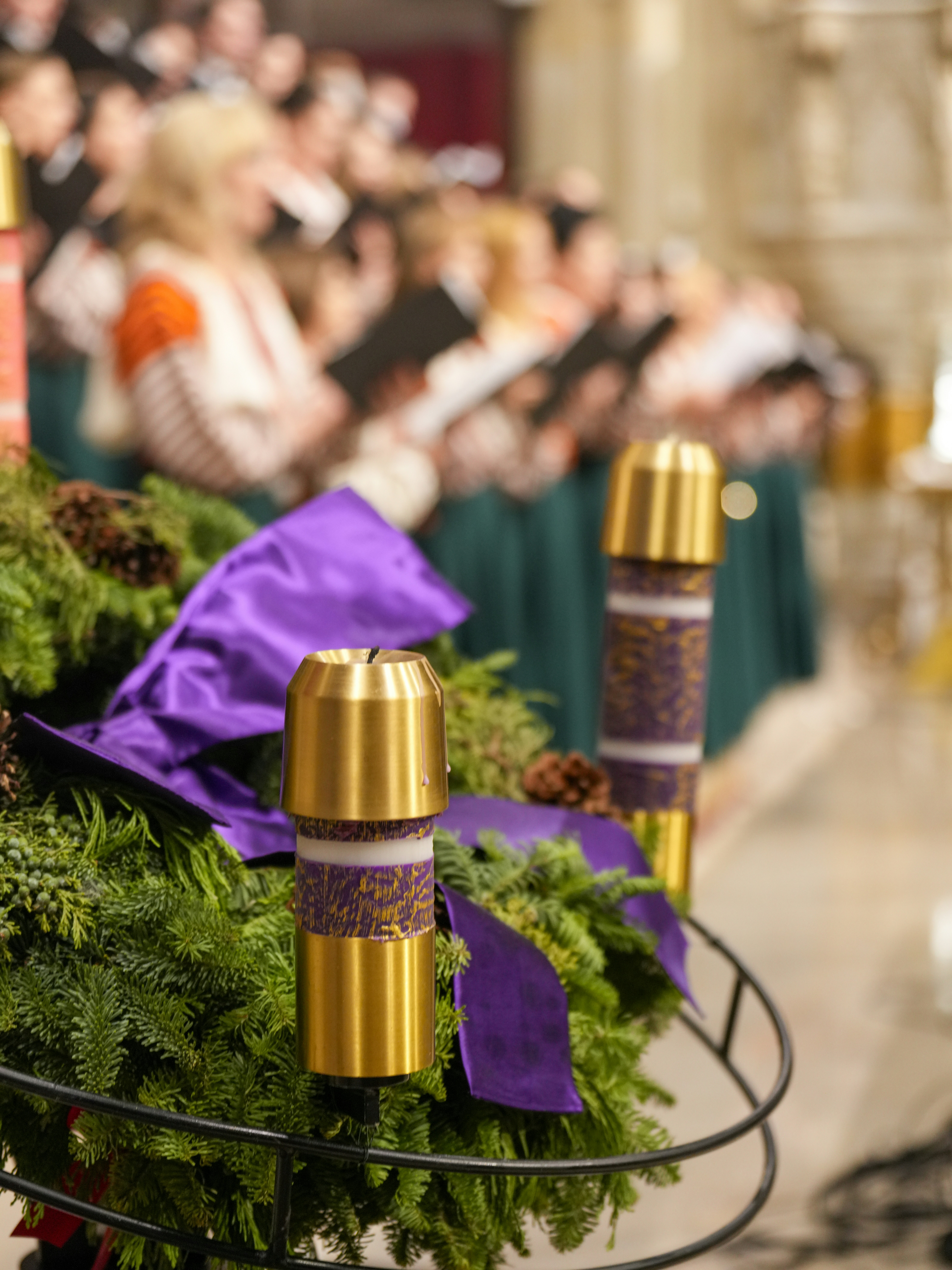 Golden bells on a festive wreath in a choir backdrop
