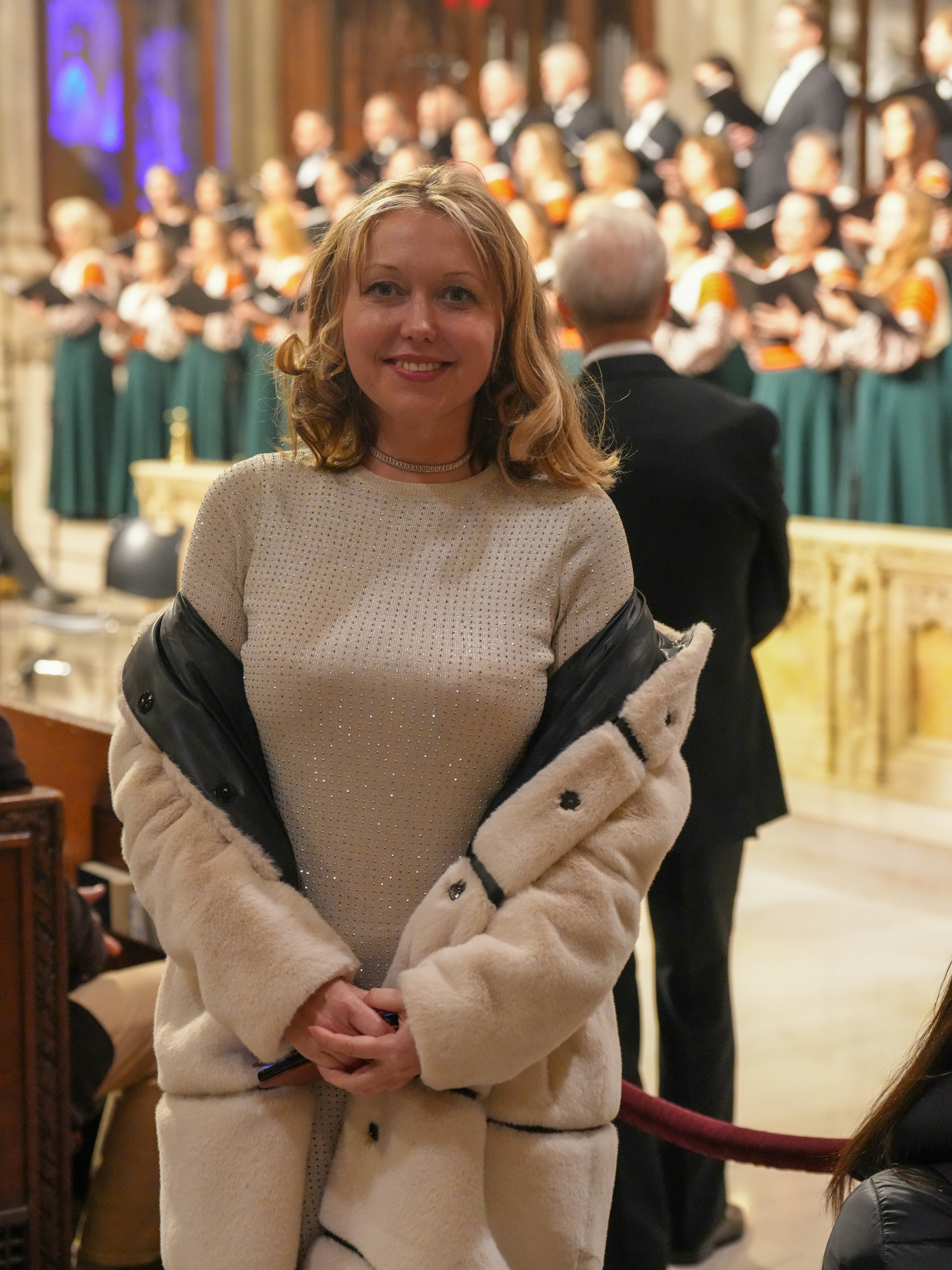 Center Stage: A poised guest in a glittering gown at a cathedral concert