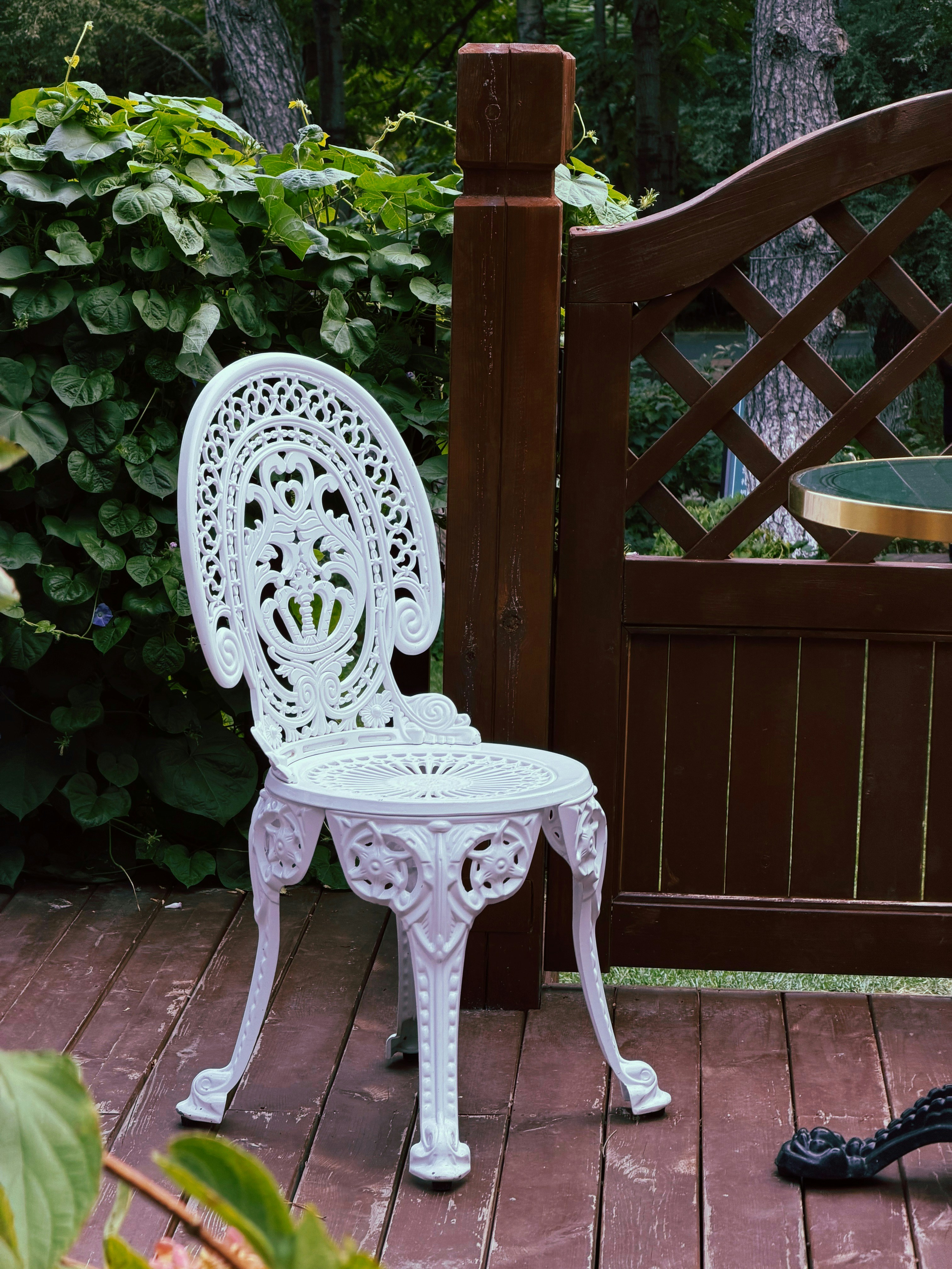 Ornate White Chair on a Garden Deck