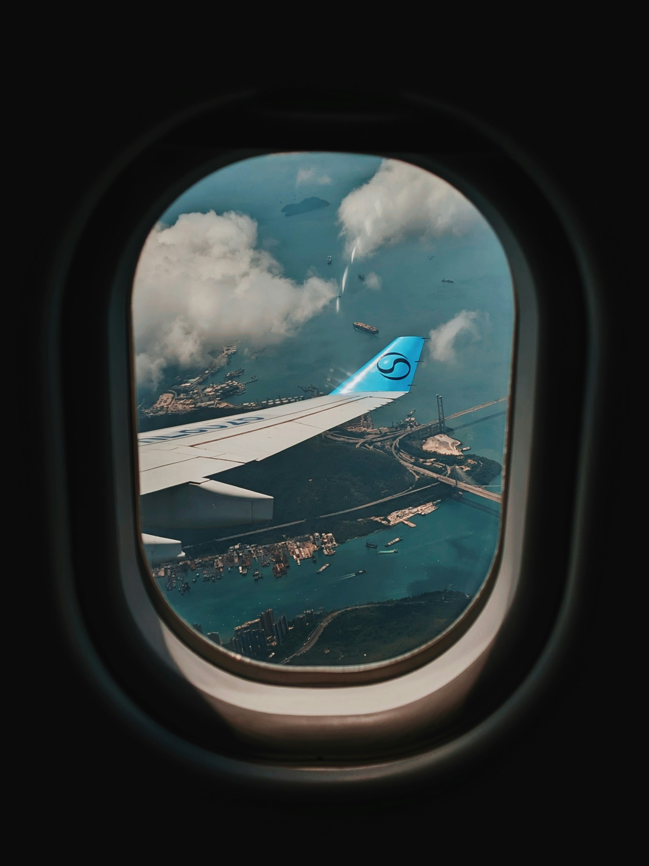Window to the Blue: Aerial View from a Passenger Seat