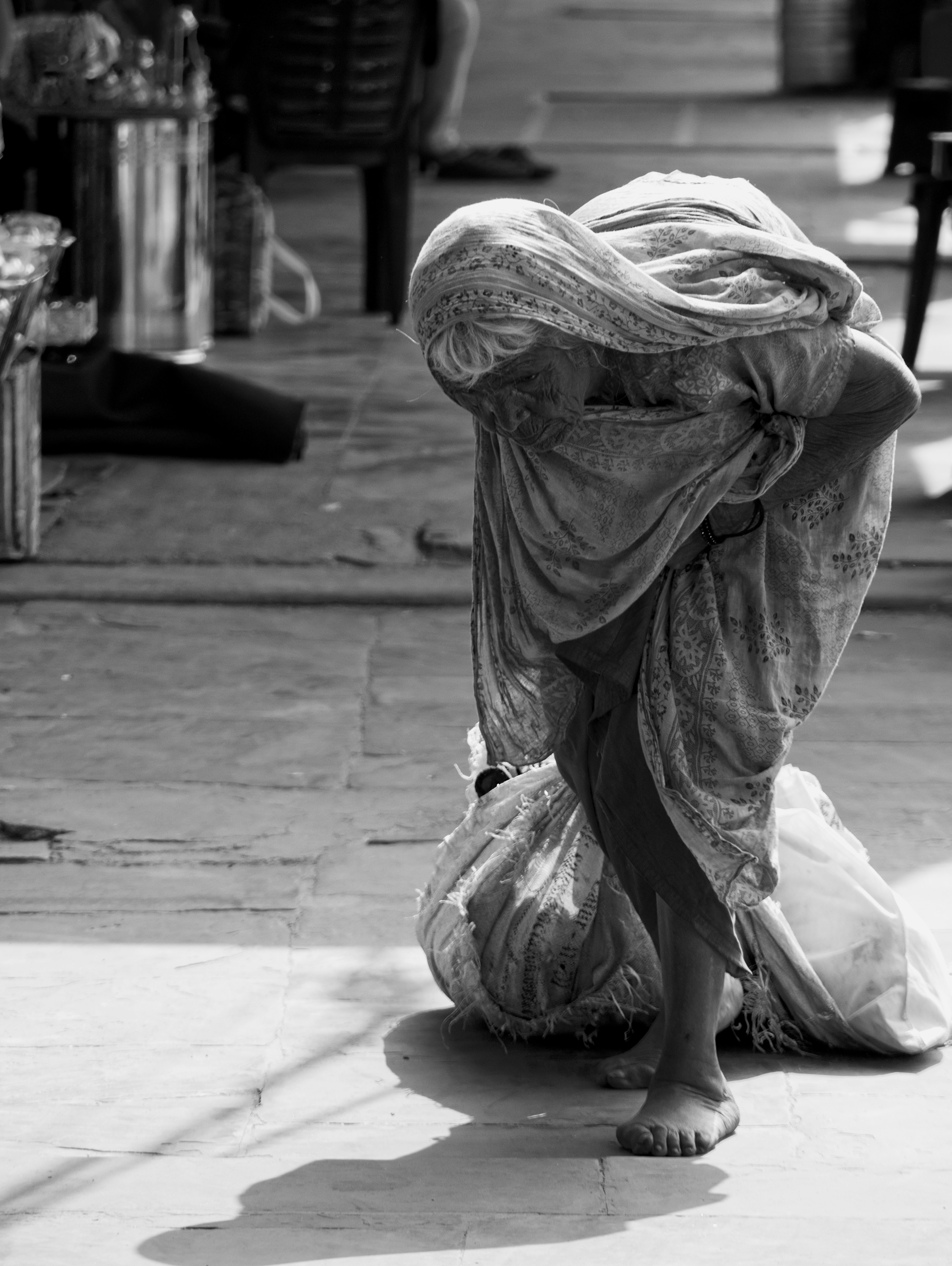 Folded Reverie: A Silent Figure in Shaded Light
