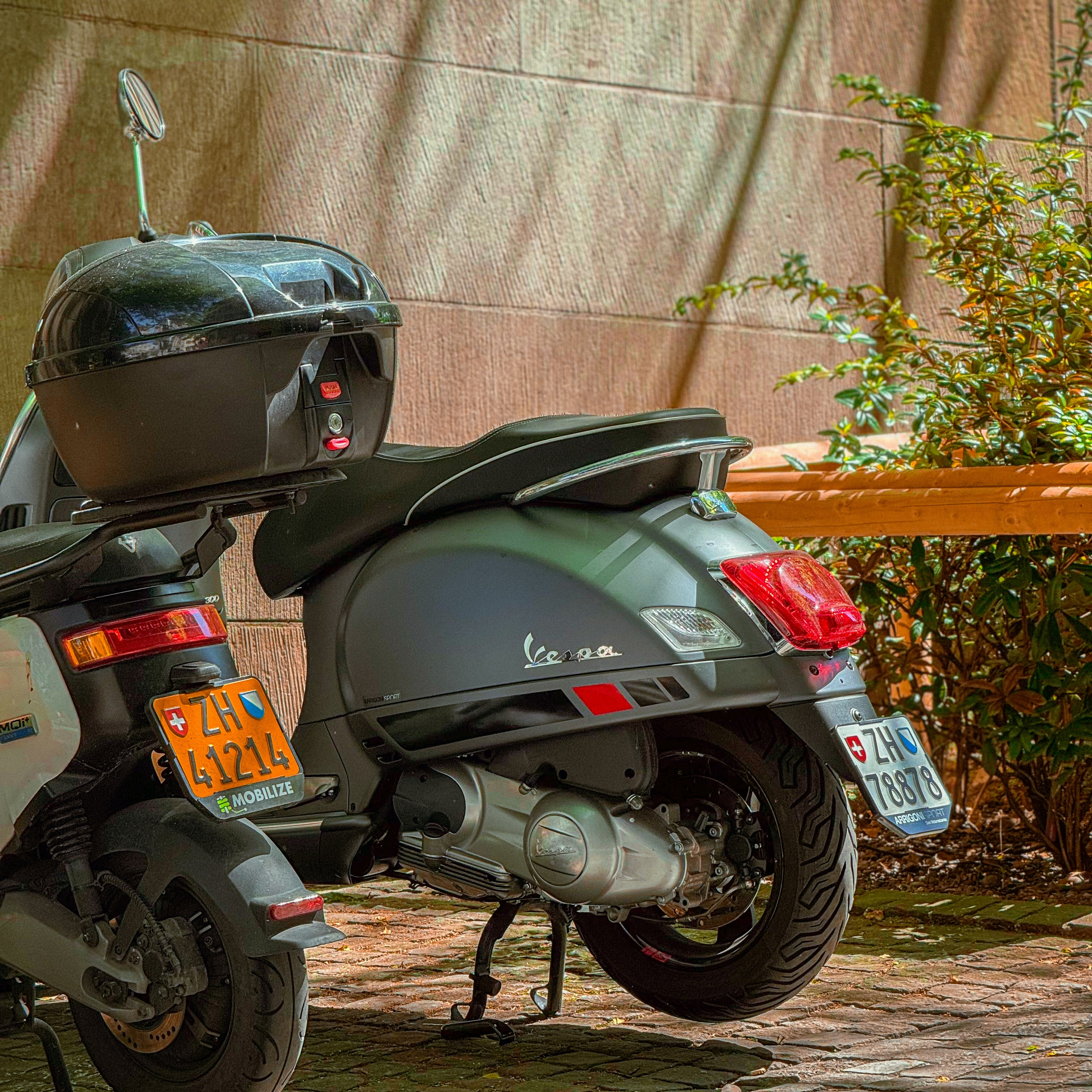 Matte Green Scooter in Shaded Courtyard