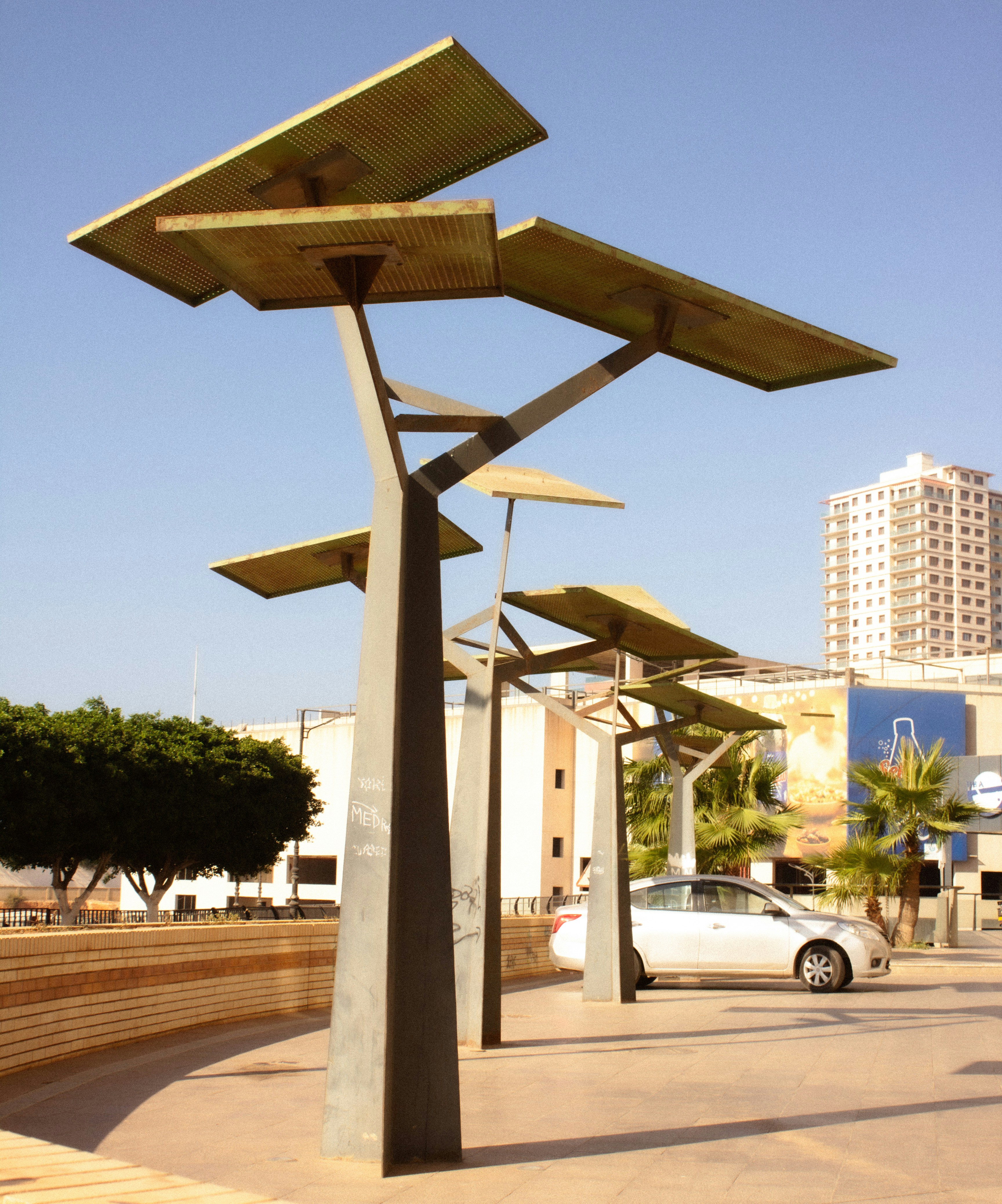 Solar Canopy Rhythm: Urban Street Lightscapes Under Clear Sky