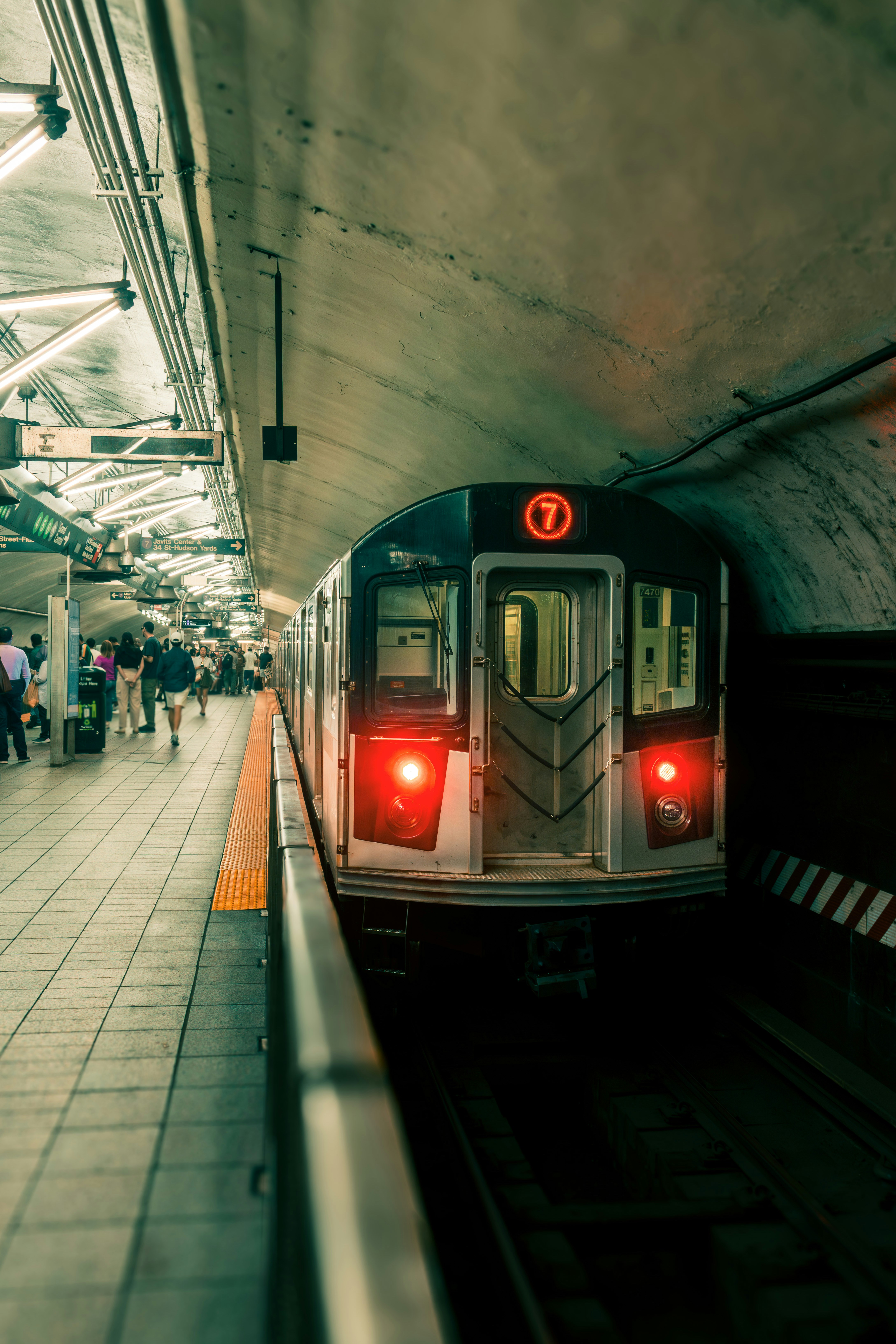 Subway Car at Platform Edge: Red Glow and Echoes in the Tunnel