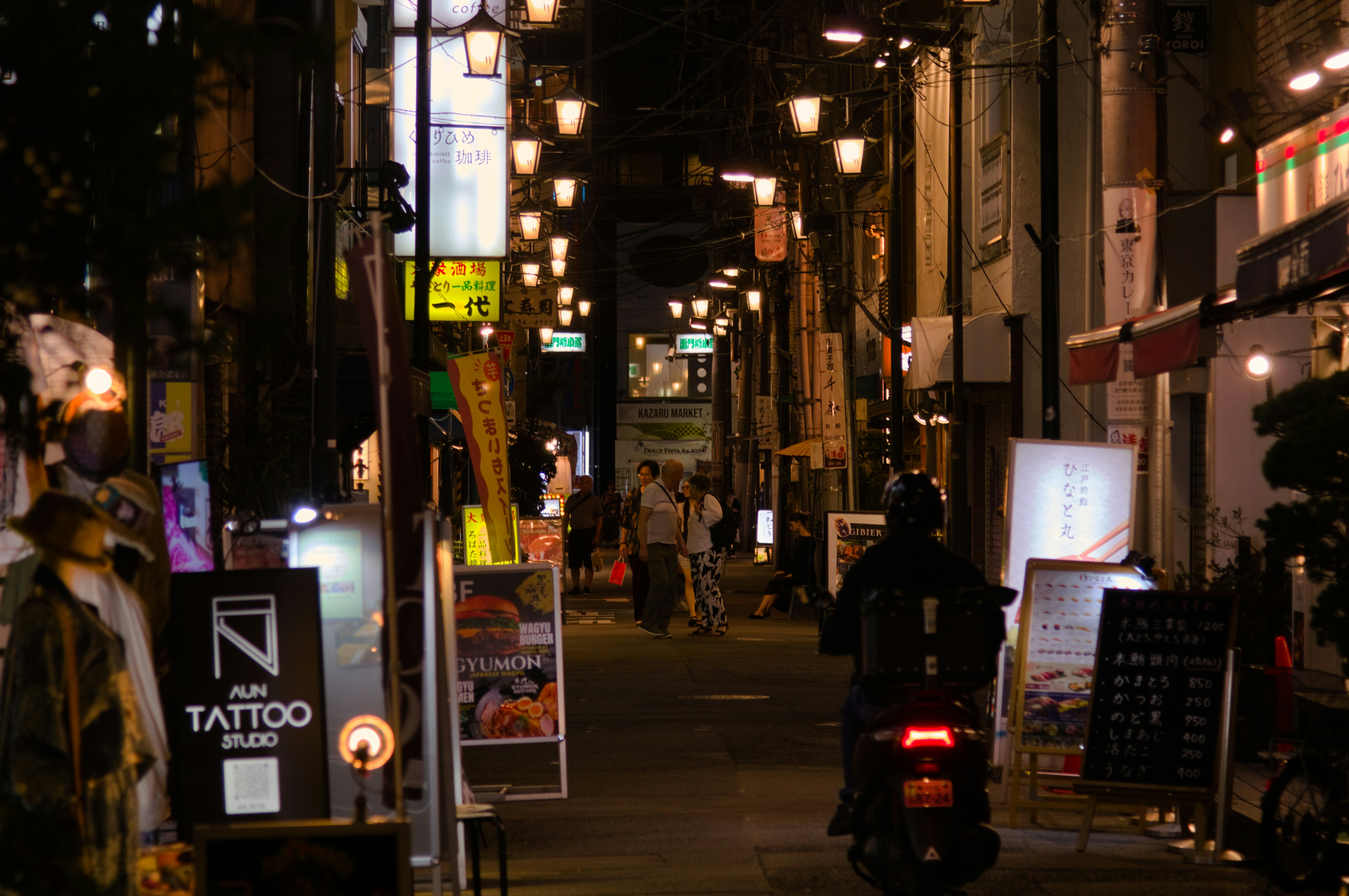 Night Market Pulse: Lanterns, Signs, and a Quiet Rider