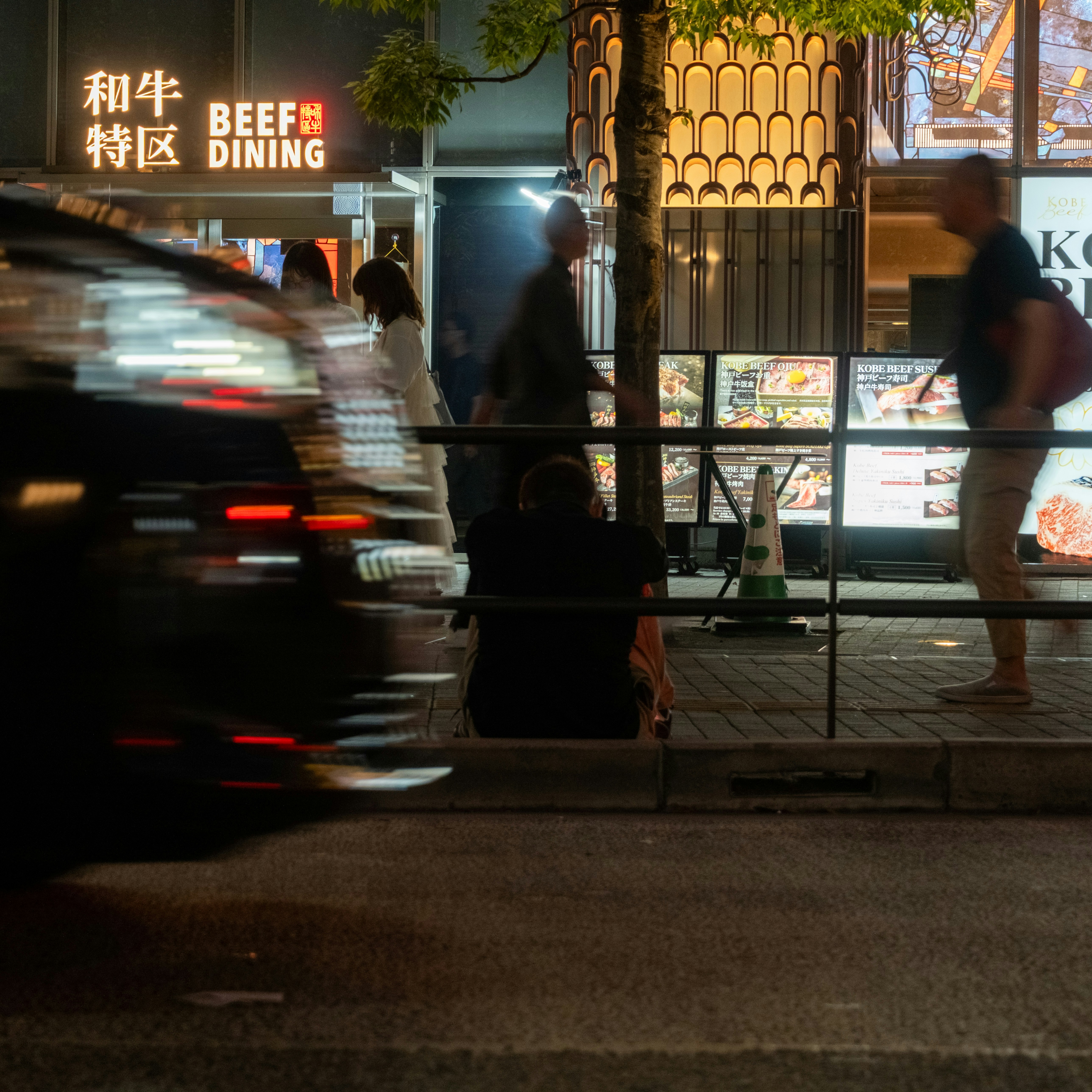 Midnight Convergence: A Quiet Figure Between City Lights