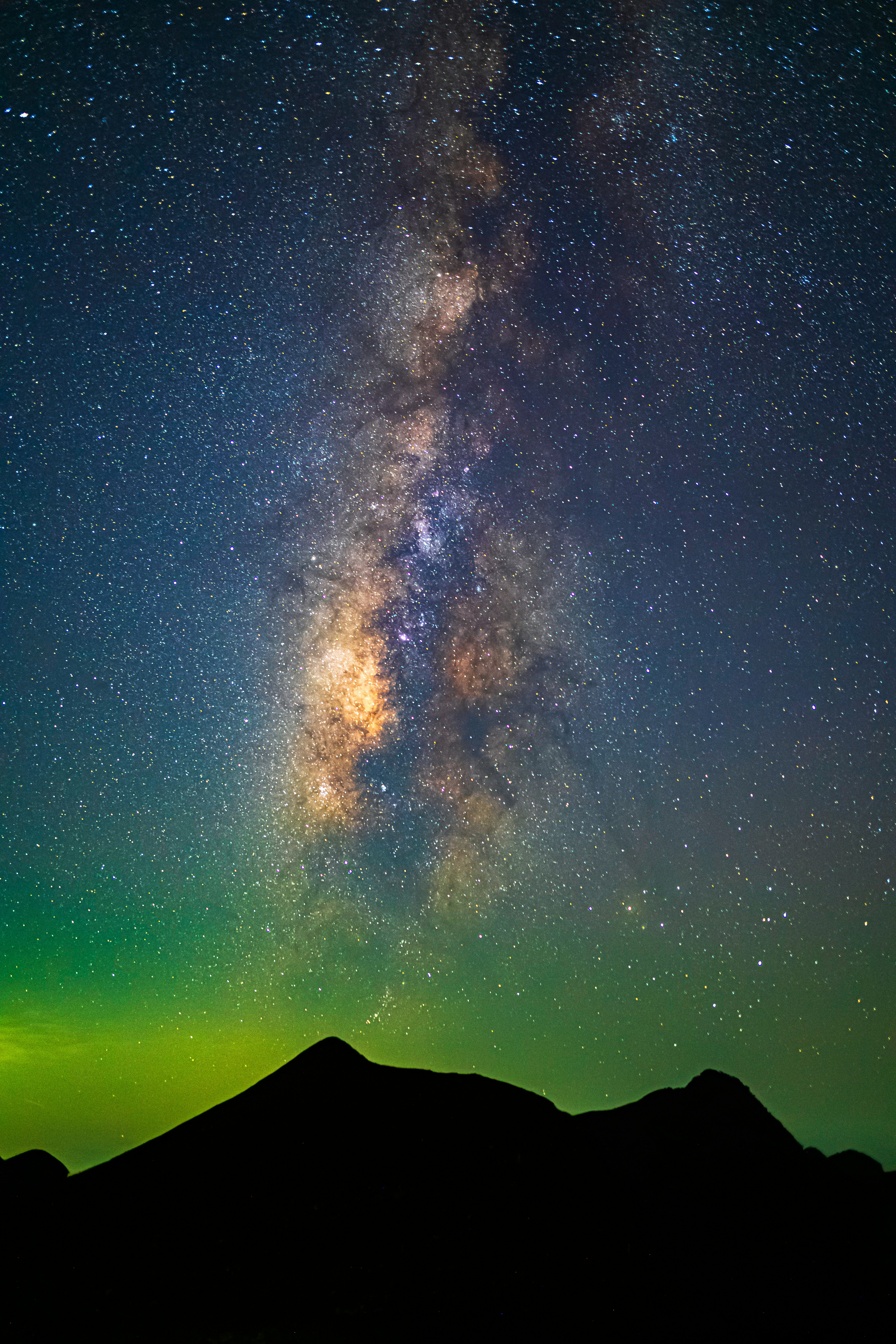 Milky Way over Silent Peaks: A Night Sky Above the Horizon