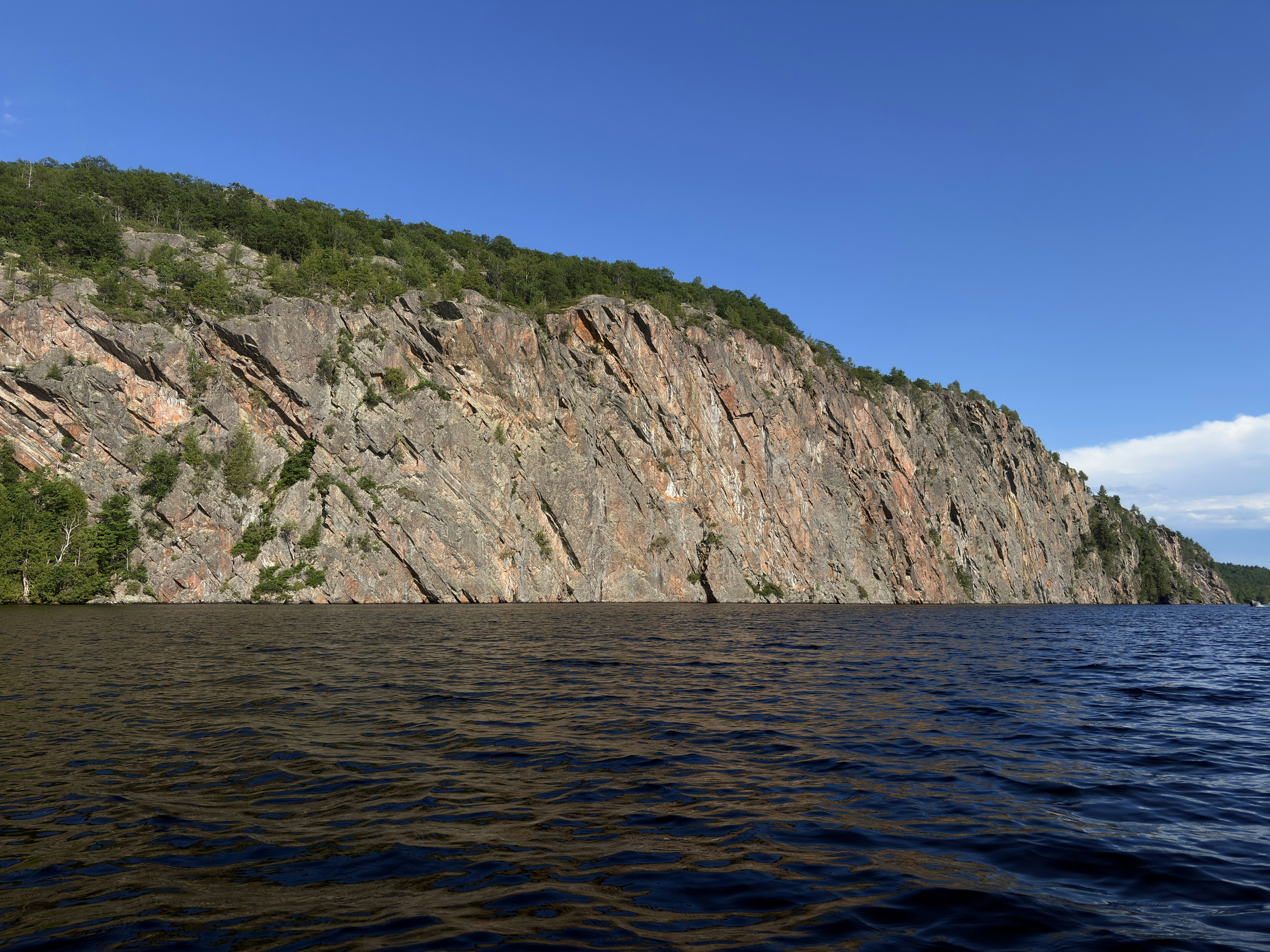 Cliffside Horizon: A Quiet Waterline Against Rugged Shore