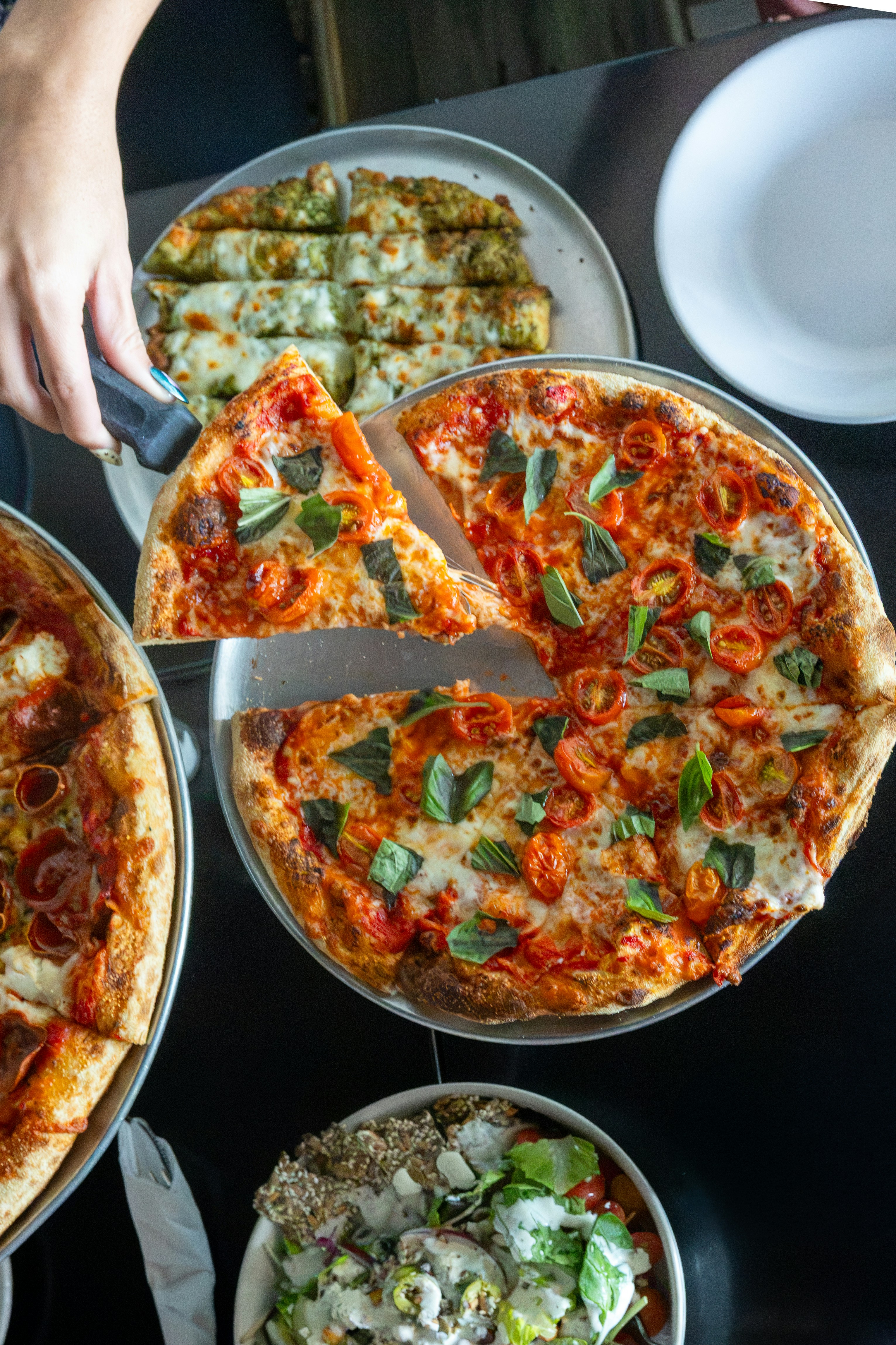 Slice Lift: A Pepperoni Pizza Moment Across a Shared Table