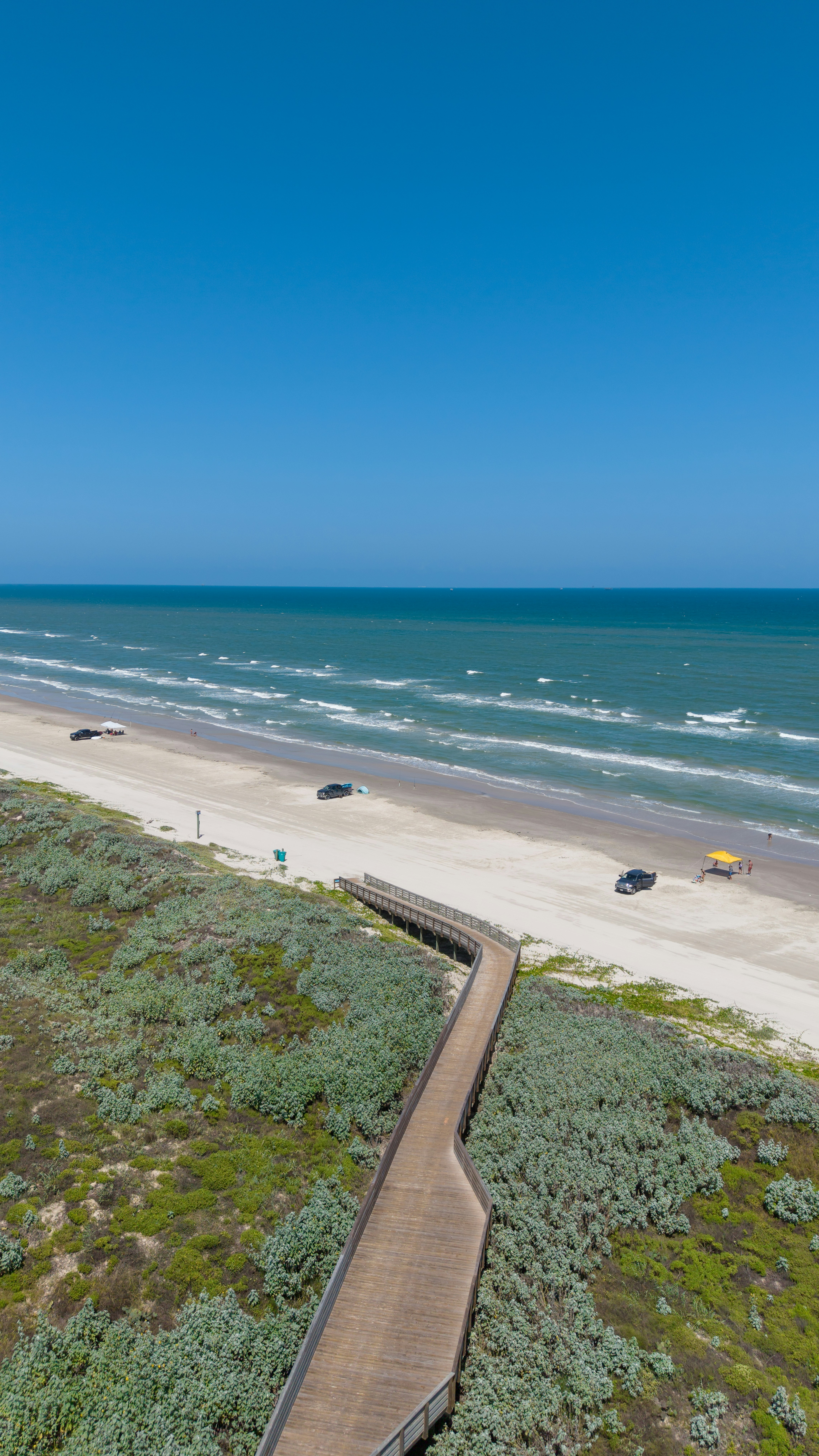 Boardwalk to the Sea: Aerial Path Through Coastal Dunes