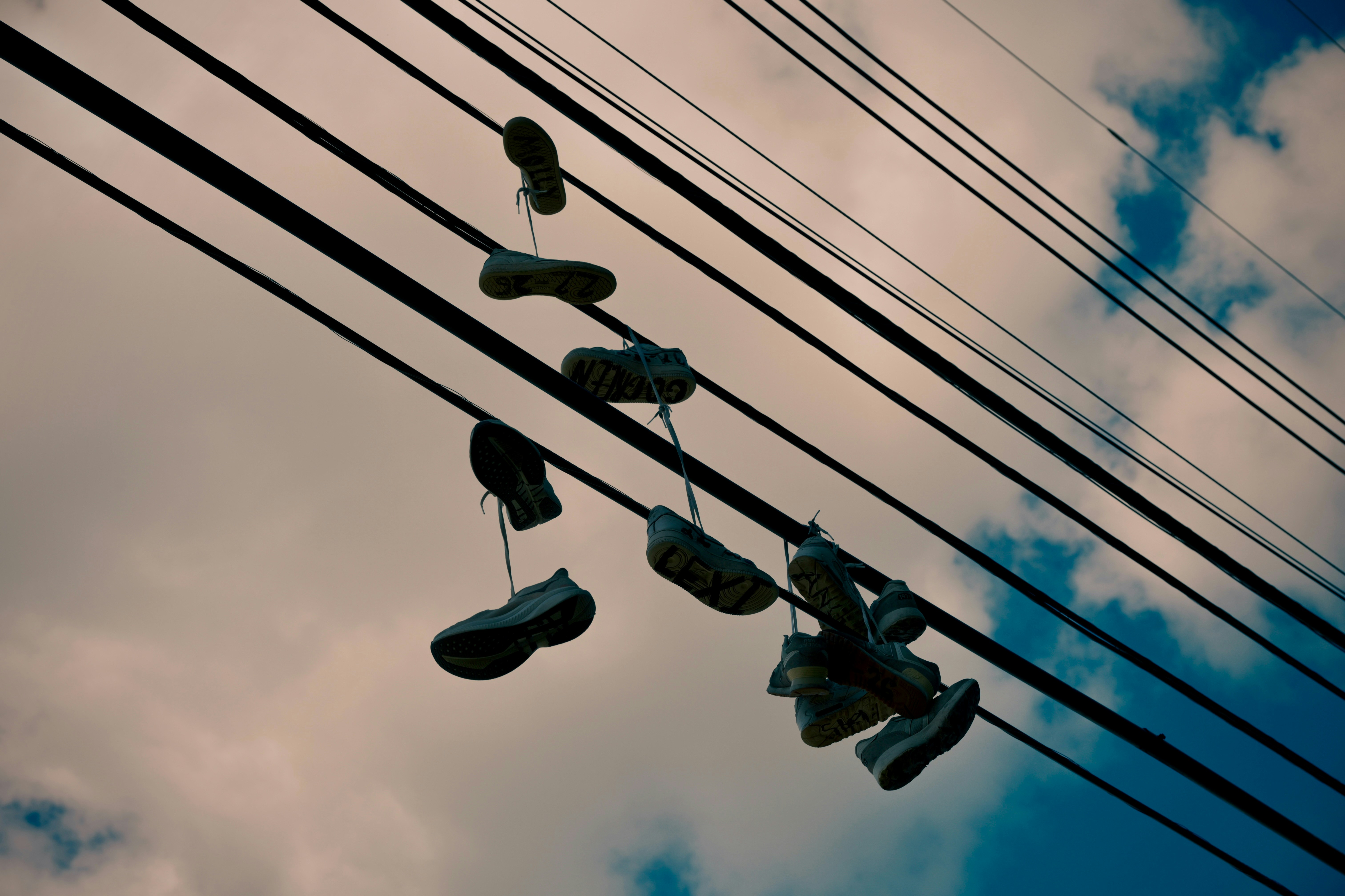 Shoes on a Wire: A Quiet Skybound Installation